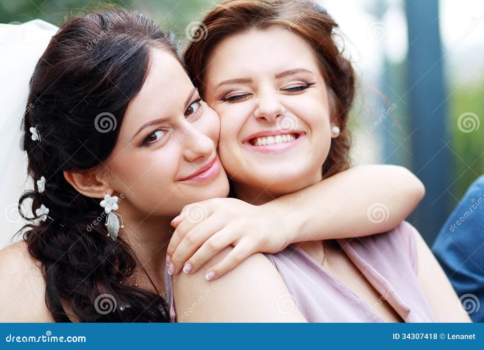 Bride and bridesmaid stock photo. Image of hugging, bridesmaid - 34307418