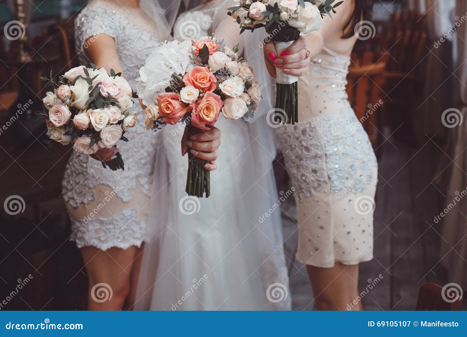 Bride and Bridesmaids Holding Bouquets Stock Image - Image of dress ...