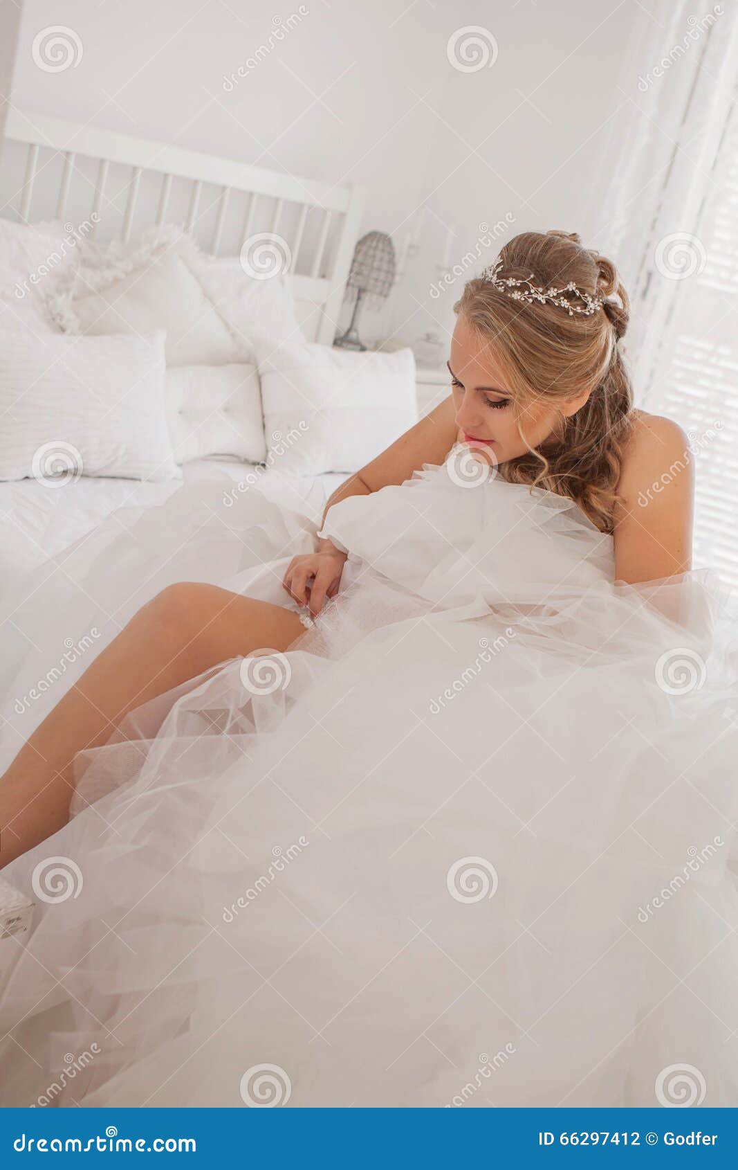 Bride Dressing Putting on Garter Stock Photo - Image of romantic ...