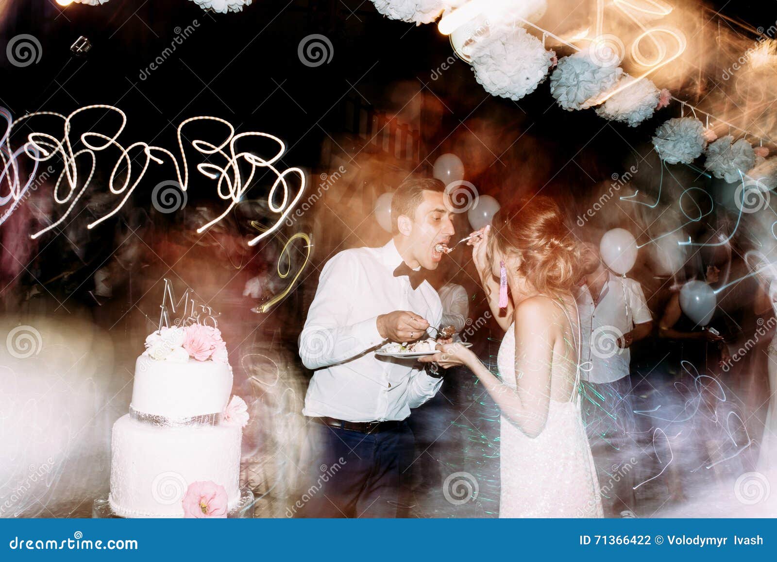 Bride is Feeding a Groom with a Wedding Cake Stock Photo - Image of ...