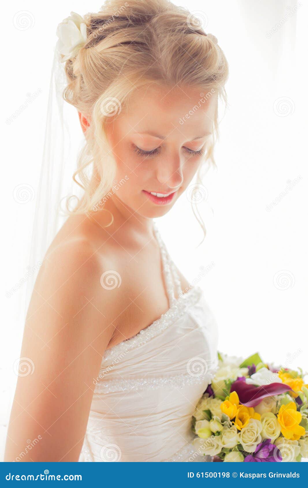 Bride with Flowers in Her Hands Looking Down Stock Photo - Image of ...