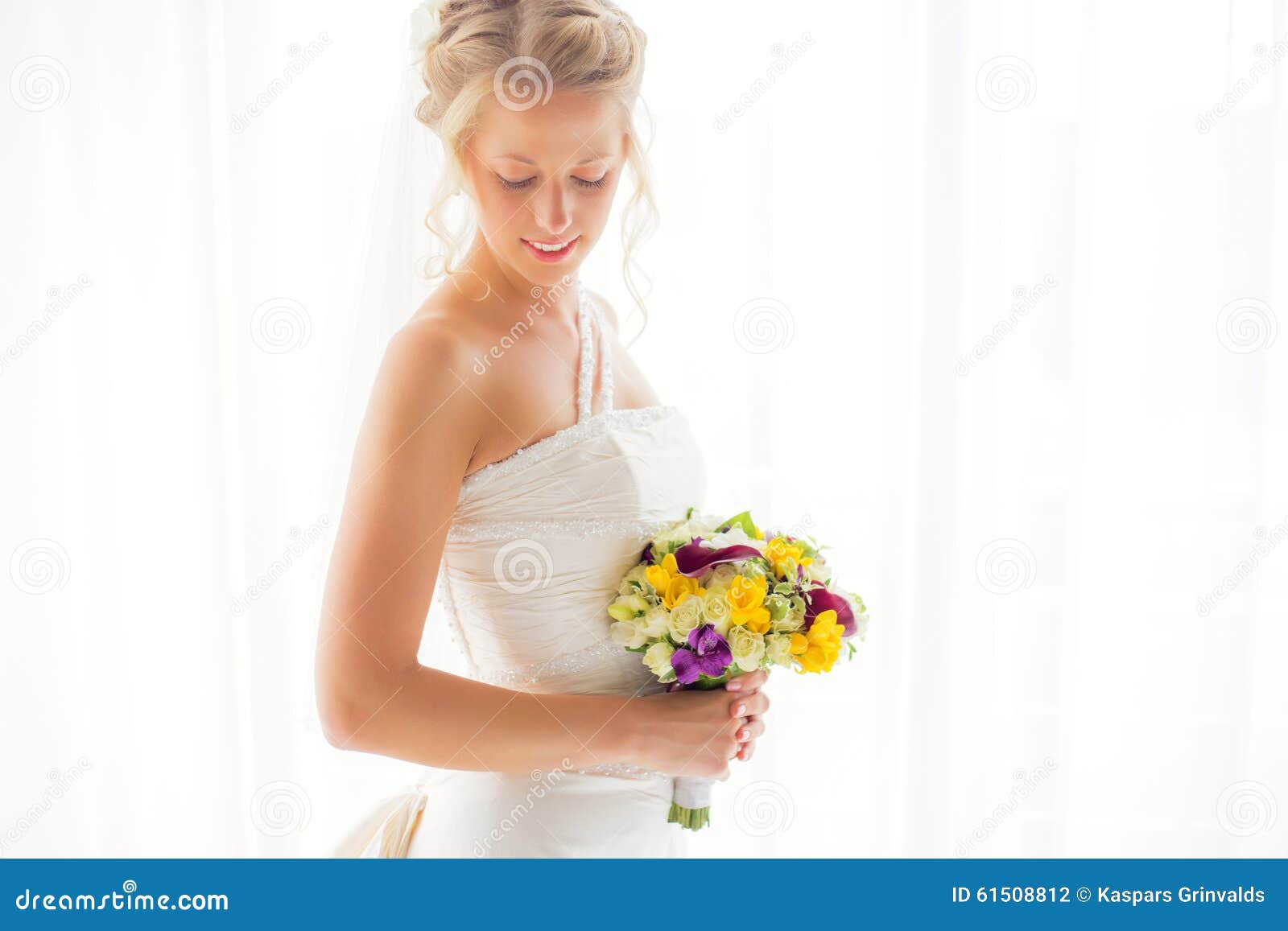 Bride with Flowers Looking Down Stock Photo - Image of looking, girl ...