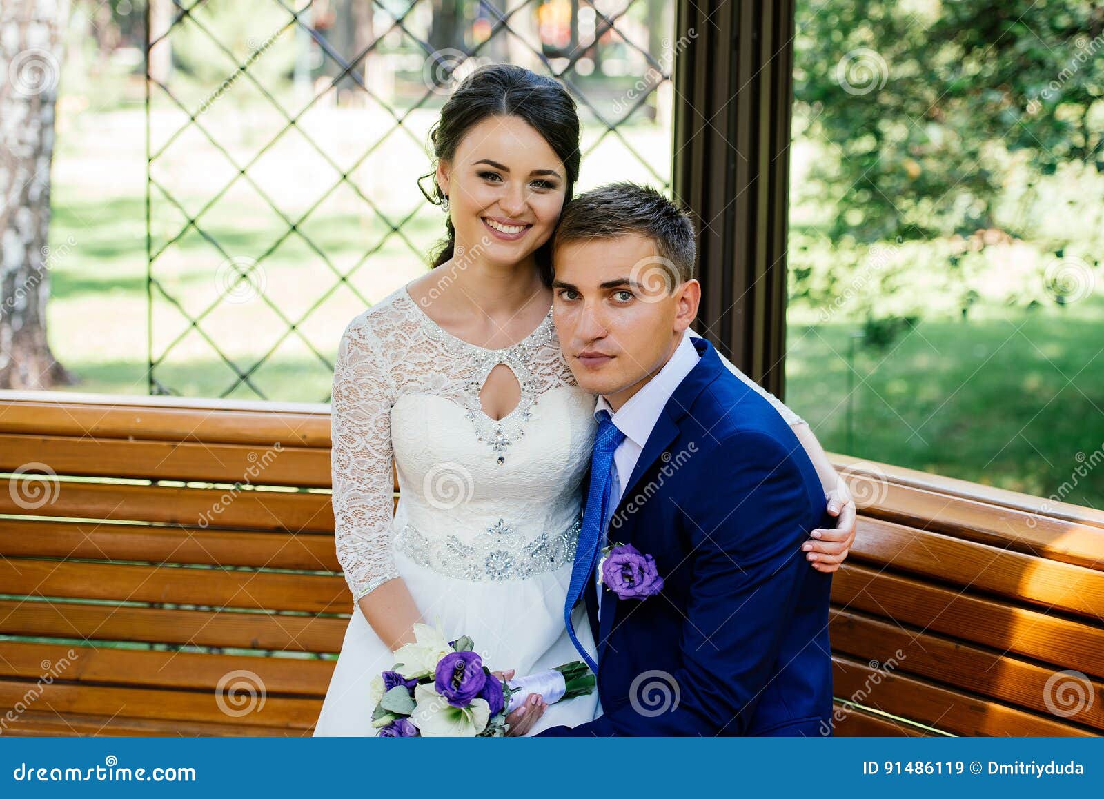 Bride and groom on a bench stock image. Image of adult - 91486119