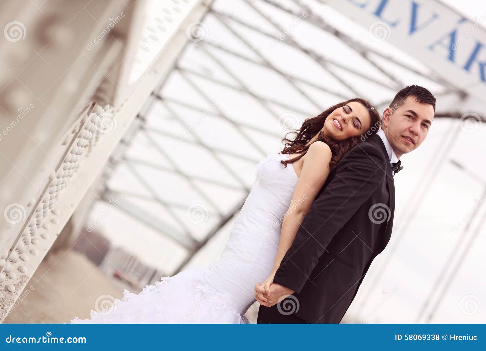 Bride and Groom on a Bridge Stock Photo - Image of enjoying, laugh ...