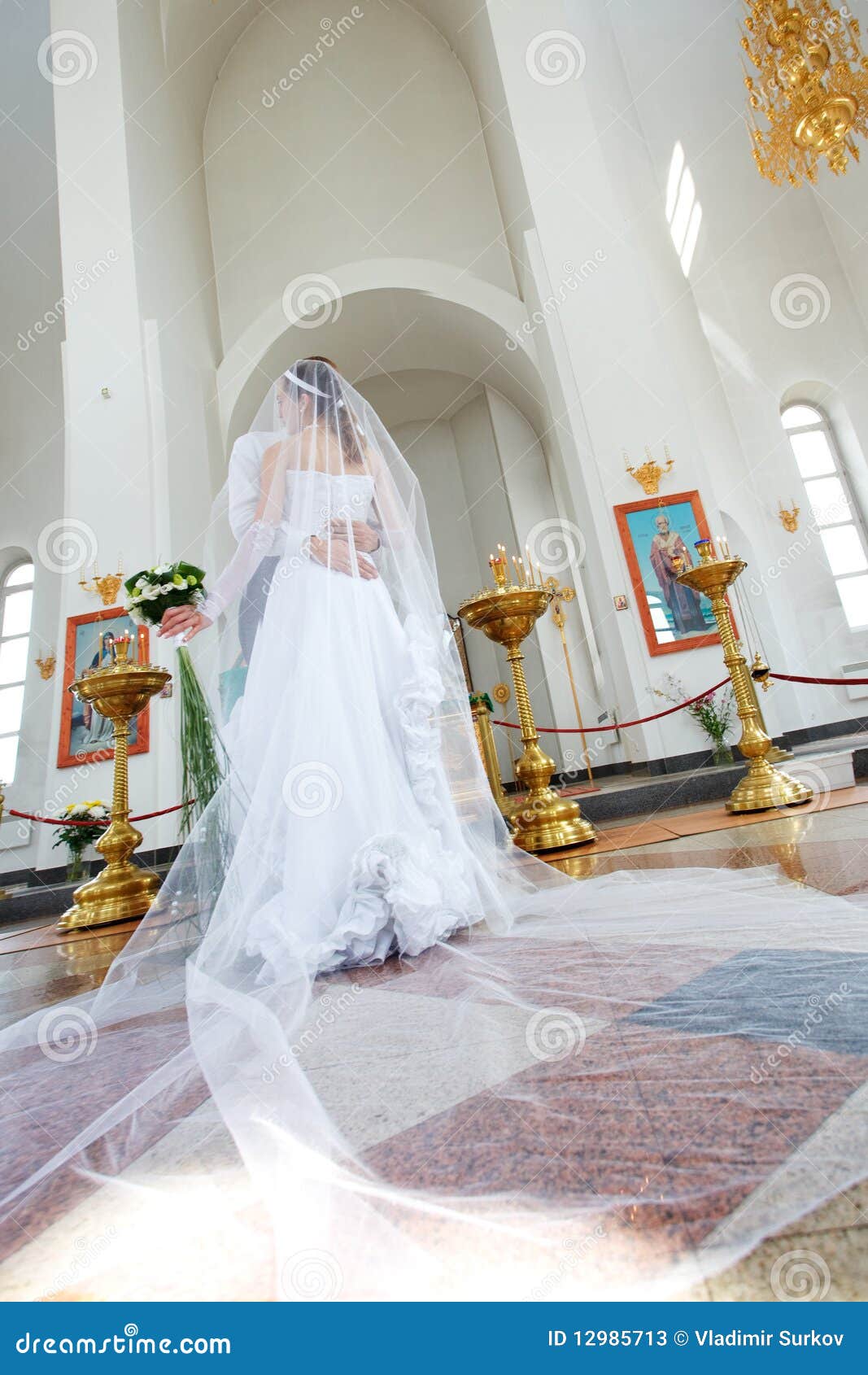 Bride and Groom in the Church Stock Image - Image of light, flowers ...