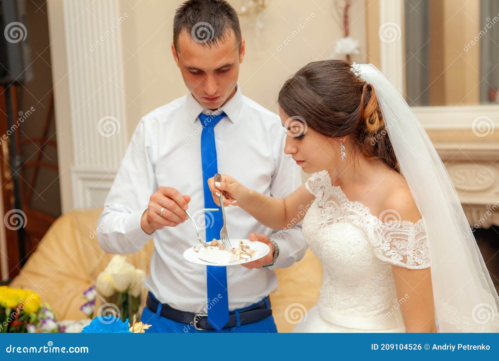 Bride and Groom Eat Wedding Cake Stock Photo - Image of food, male ...
