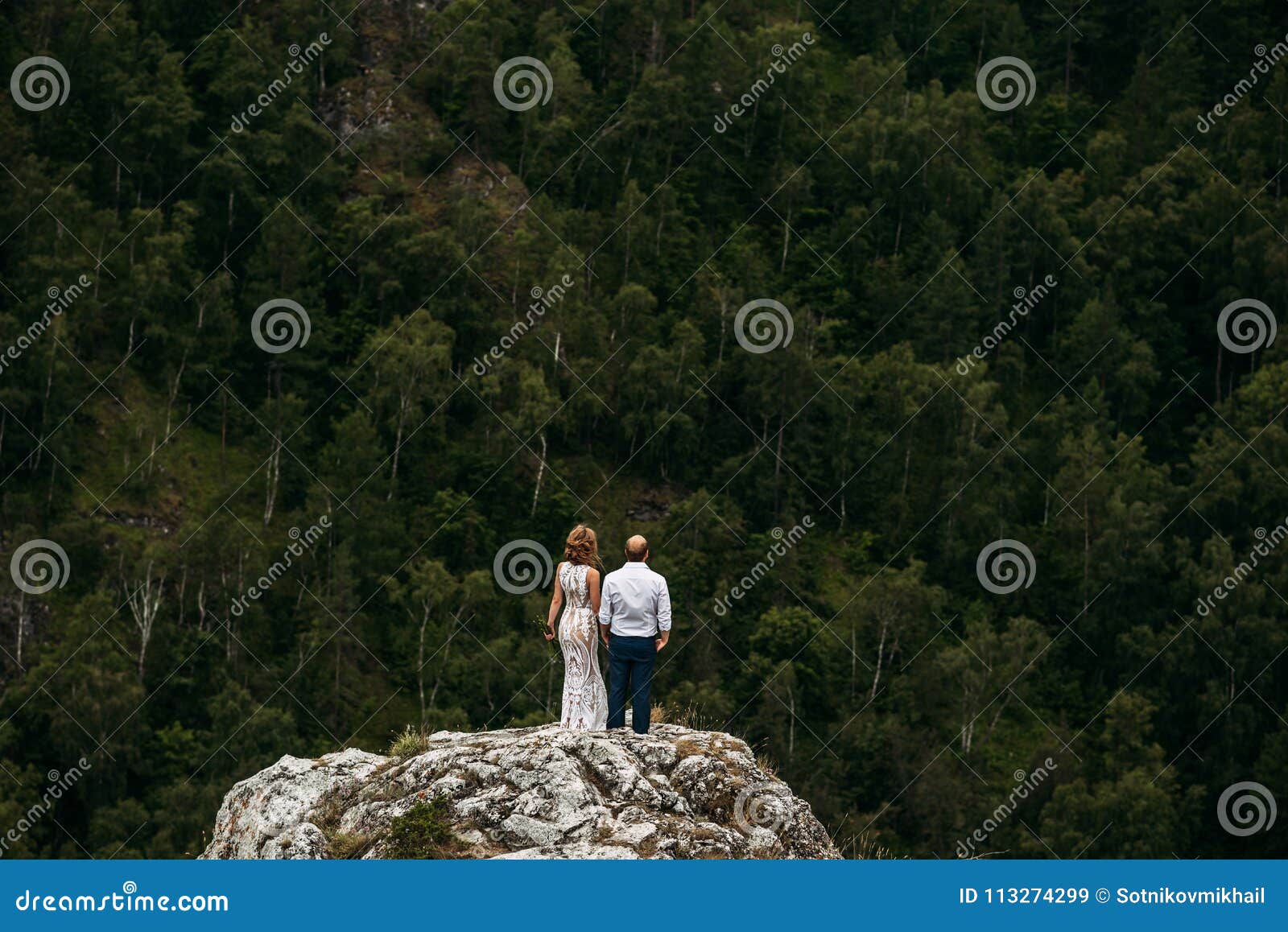 Wedding Couple on the Edge of the Mountain. Wedding Travel. Loving ...