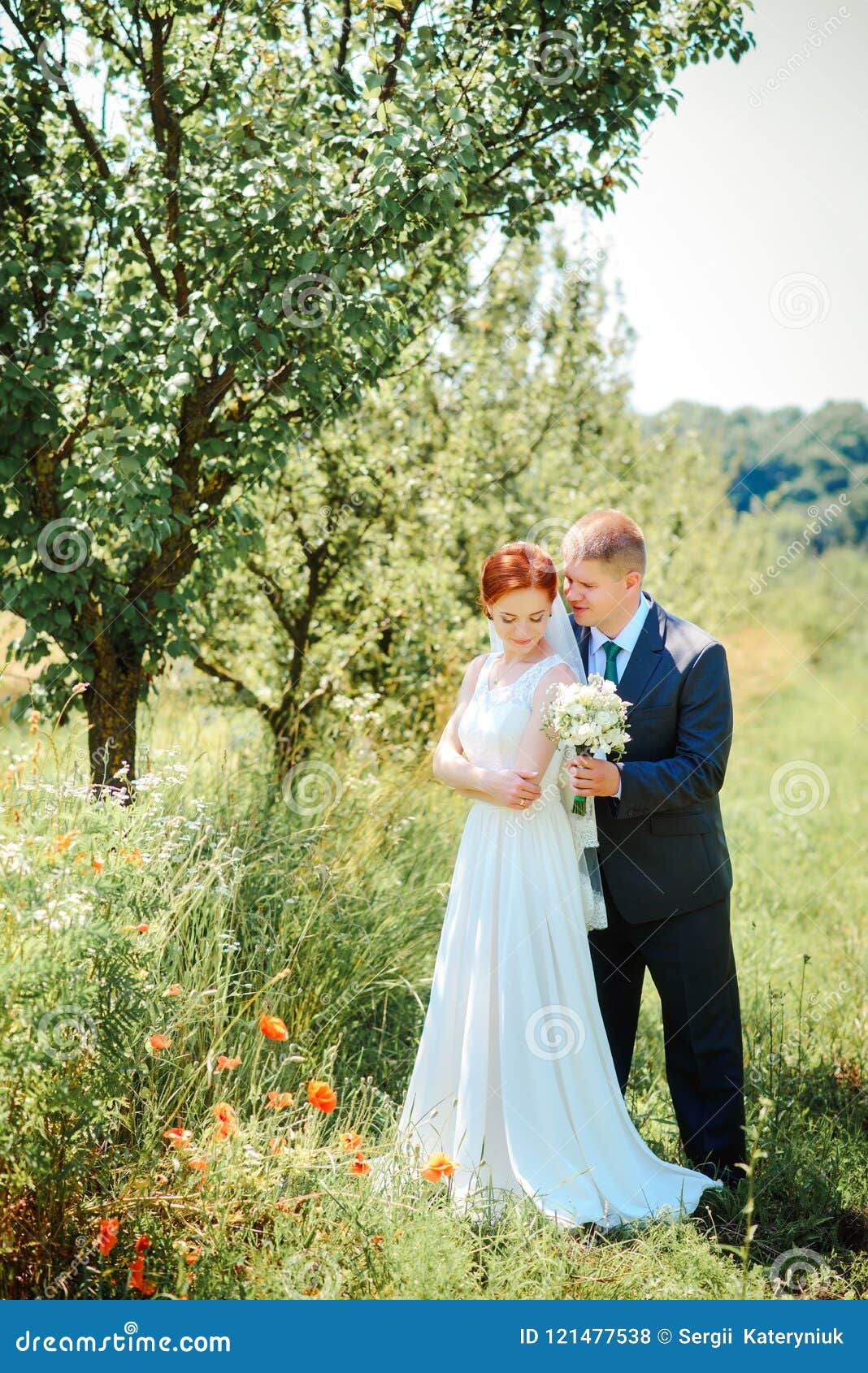 Bride and Groom Hold Each Other Hands while they Walk Along the Stock ... Bride and Groom Hold Each Other Hands while they Walk Along the Stock ...