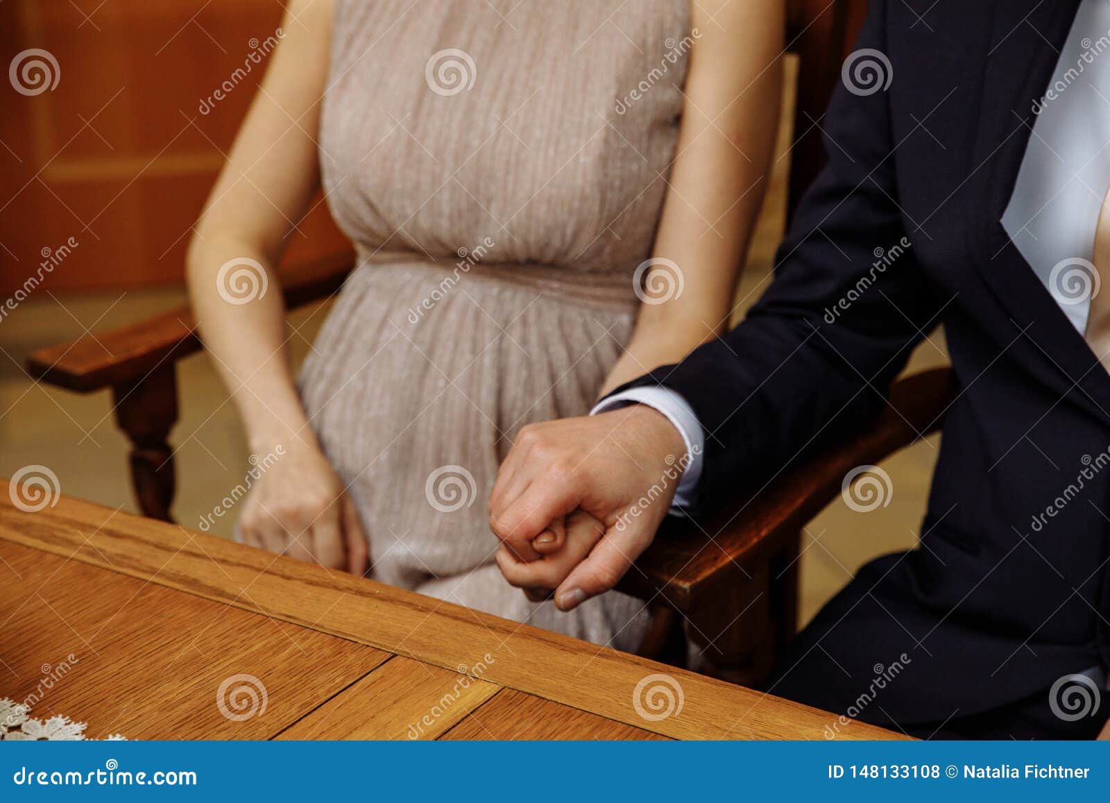 Bride and Groom Hold Hands during the Wedding Ceremony Stock Photo ... Bride and Groom Hold Hands during the Wedding Ceremony Stock Photo ...
