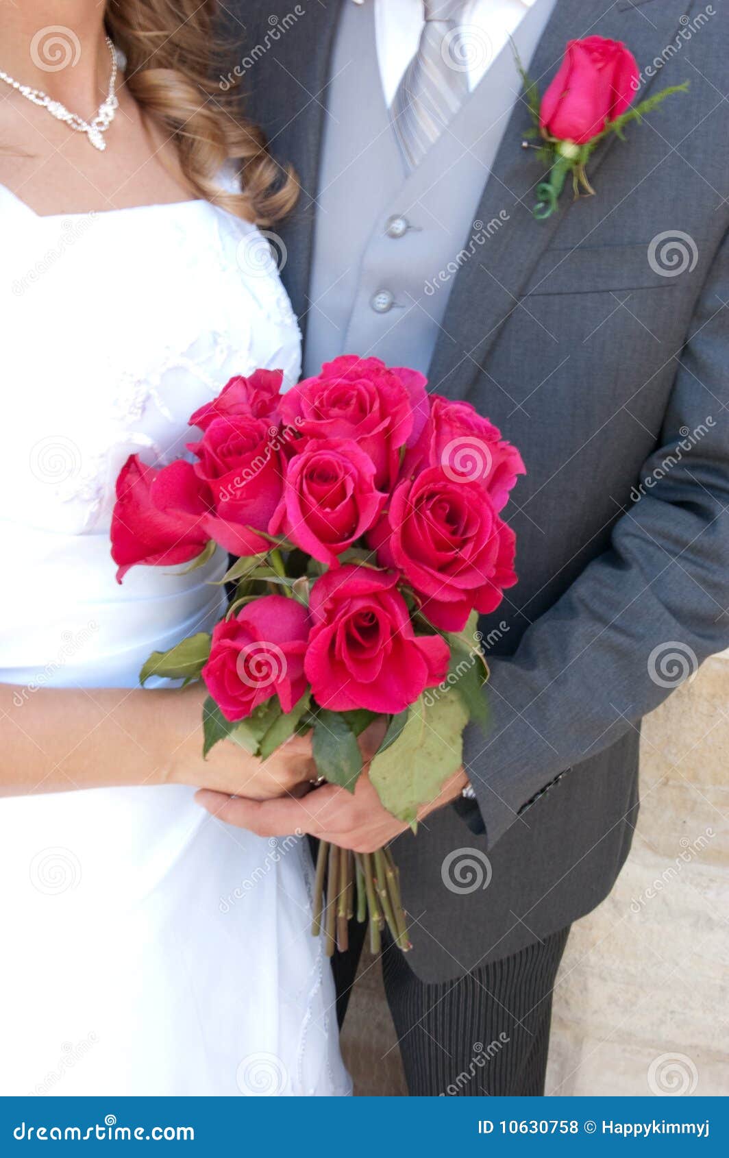 Bride and Groom Holding Roses Stock Photo - Image of female, romance ...