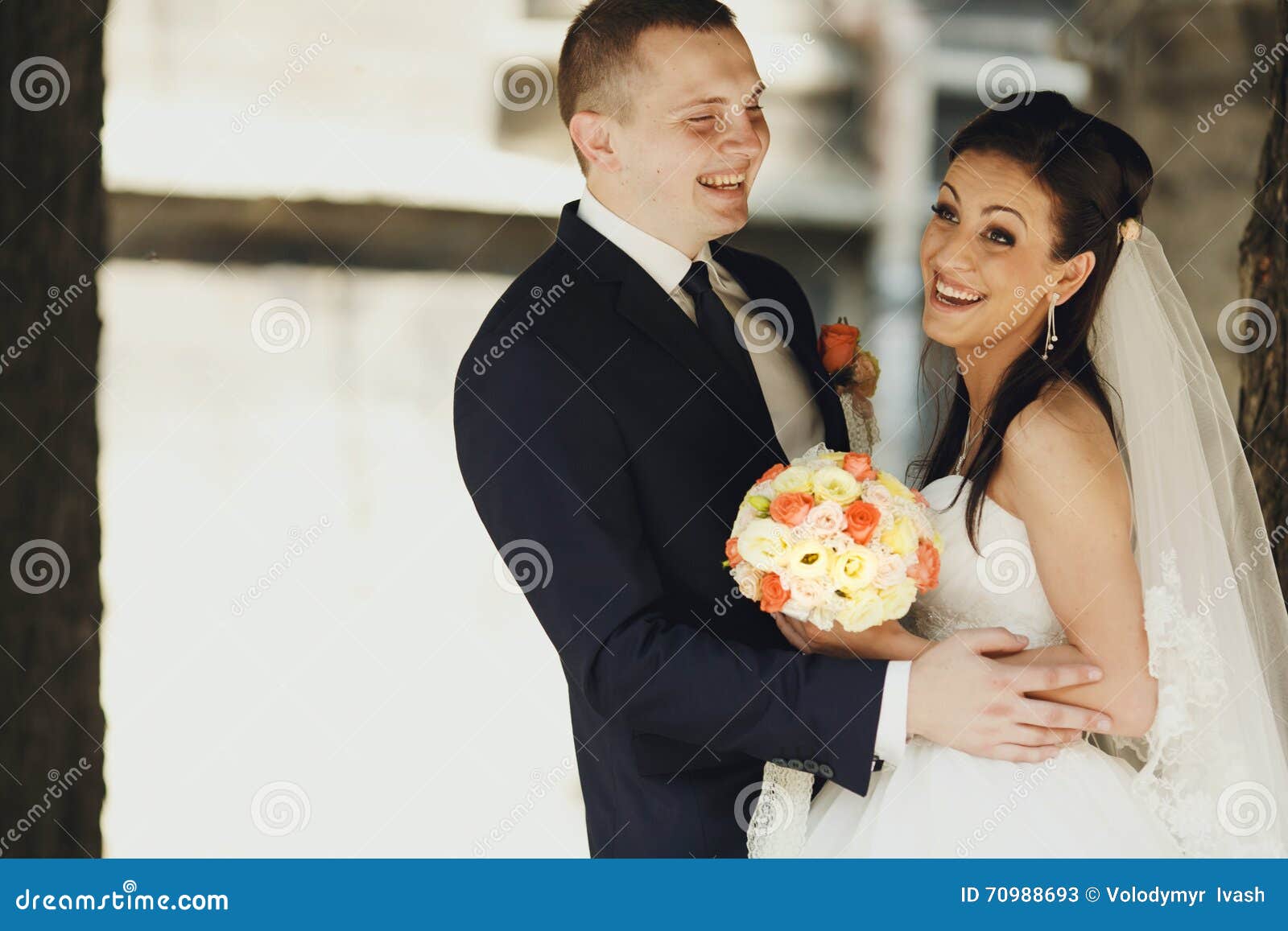 Bride and Groom Laugh while Being Photographed Stock Image - Image of ...