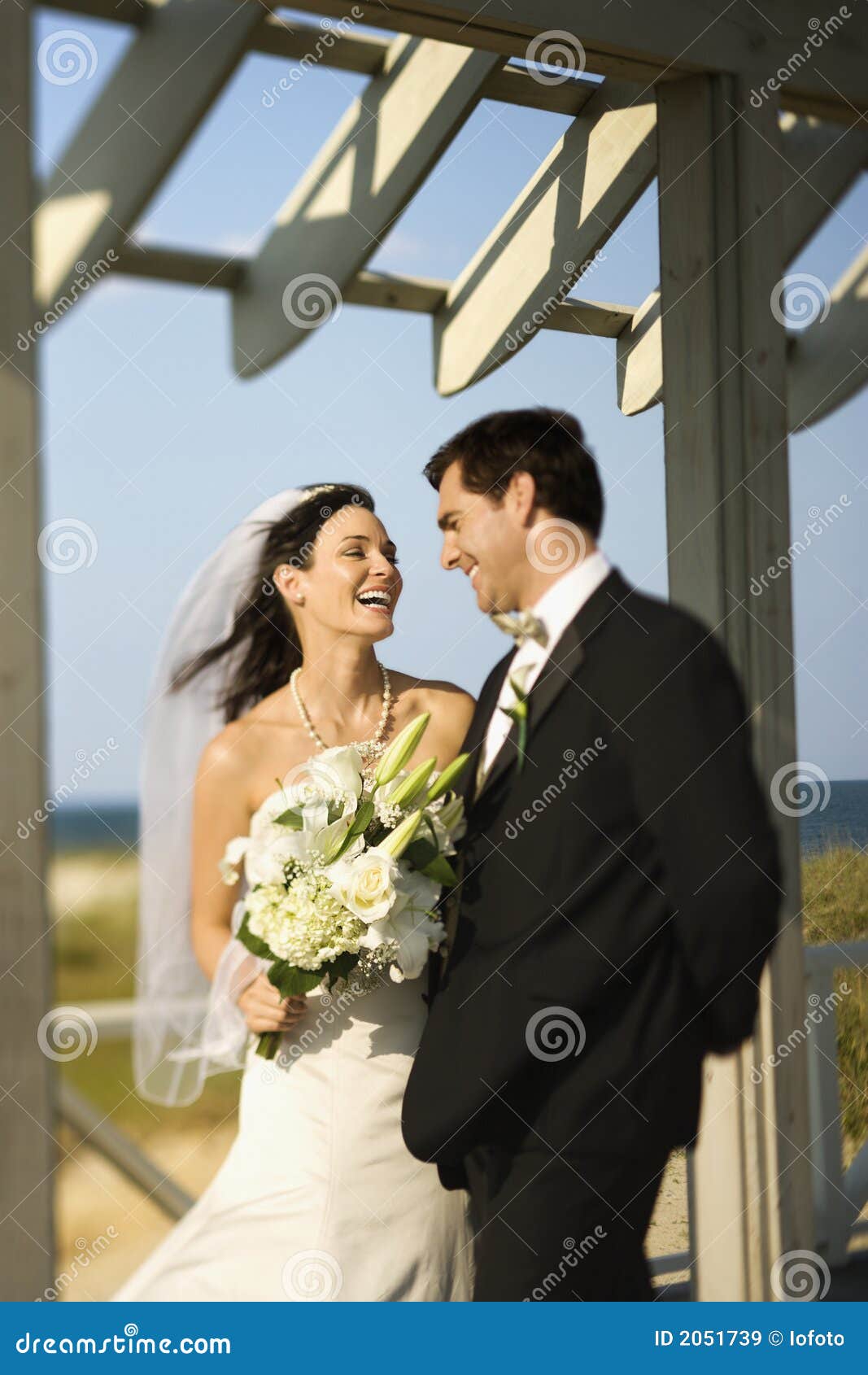 Bride and groom laughing. stock image. Image of woman - 2051739