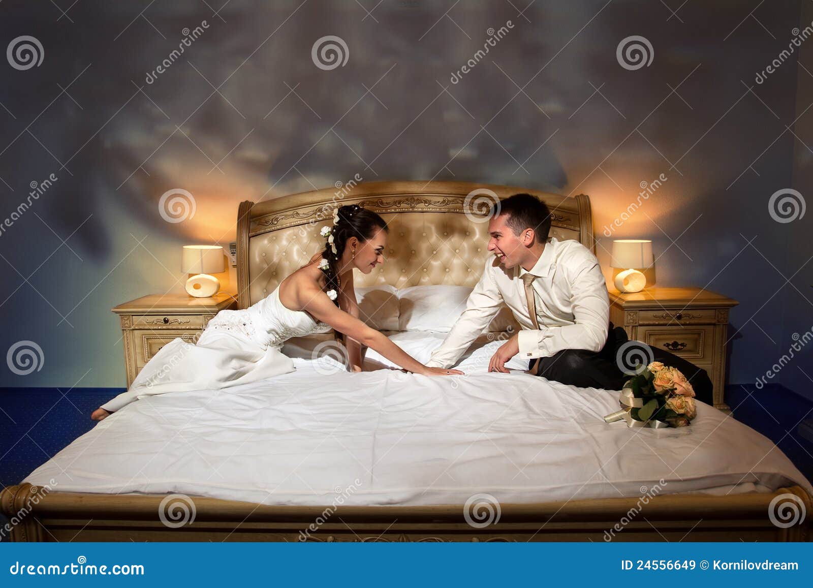 Bride and Groom Lying on Bed Stock Image - Image of beauty, dress: 24556649