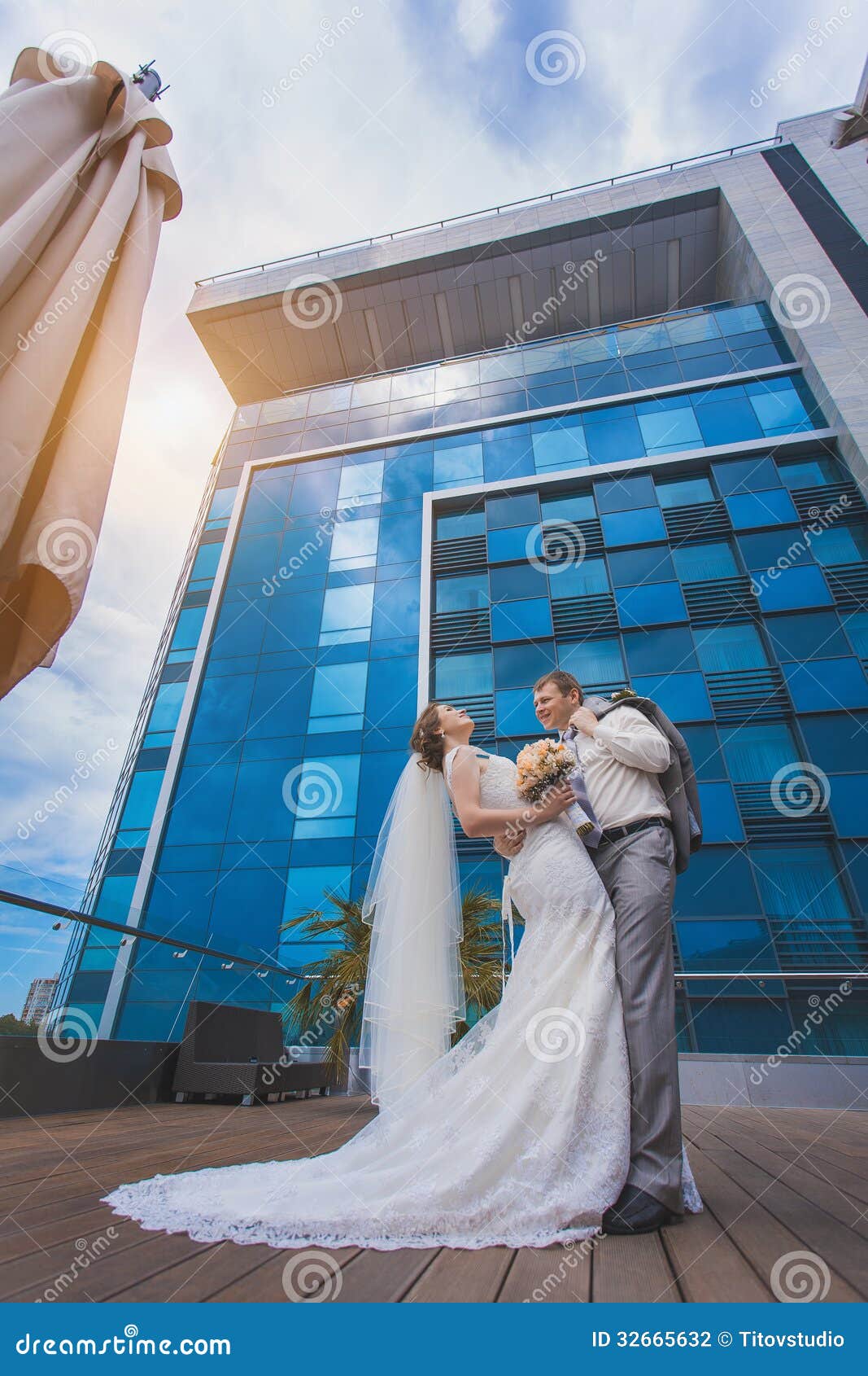 Bride and Groom Near the Building Stock Photo - Image of blue ...
