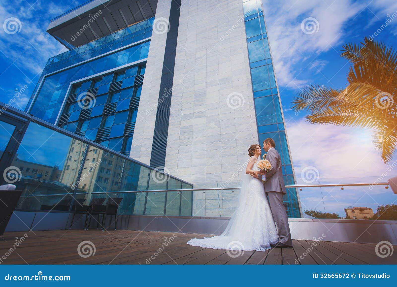Bride and Groom Near the Building Stock Photo - Image of glass ...