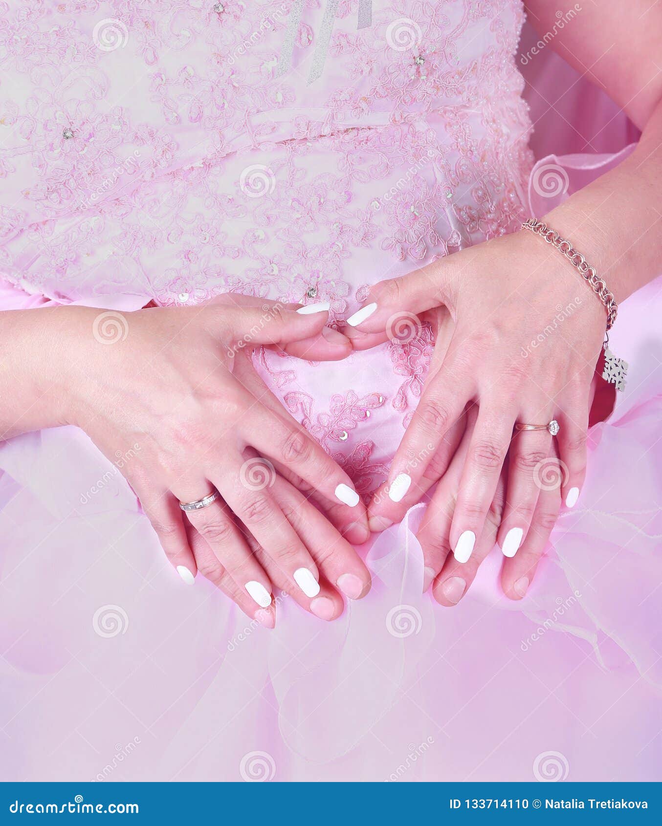 Bride and Groom in Pink Holding Hands in the Form of a Heart Stock ...