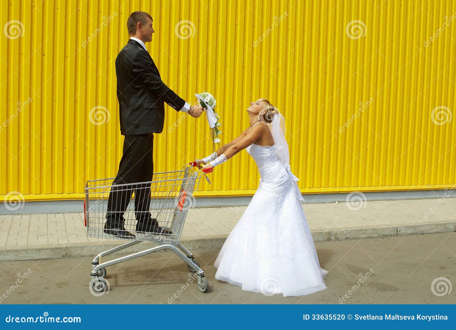 Bride and Groom Playing with a Basket of Supermarket Stock Photo ...
