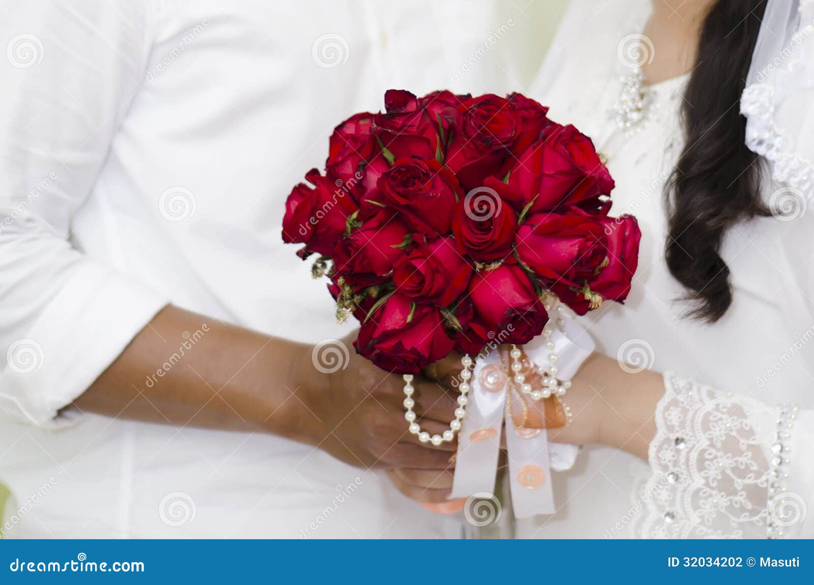 Bride and Groom with Red Rose Bouquet Stock Photo - Image of rose ...