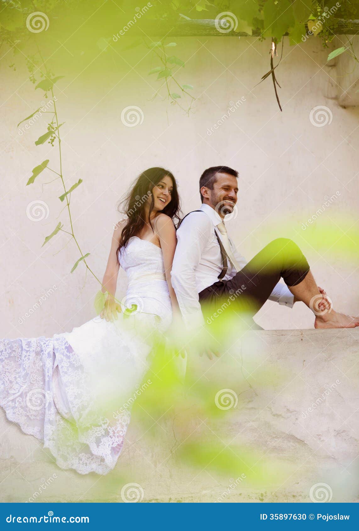 Bride and groom relaxing stock photo. Image of hold, nature - 35897630