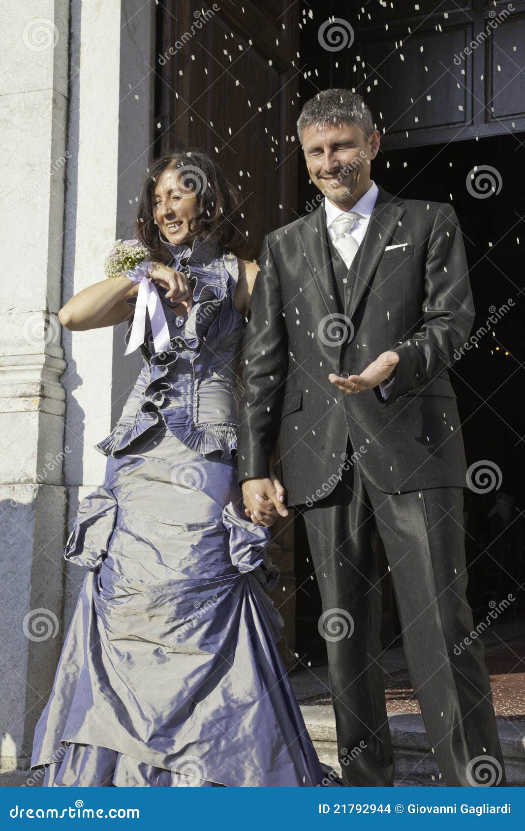 Bride and Groom during Rice Throwing Stock Photo - Image of pretty ...