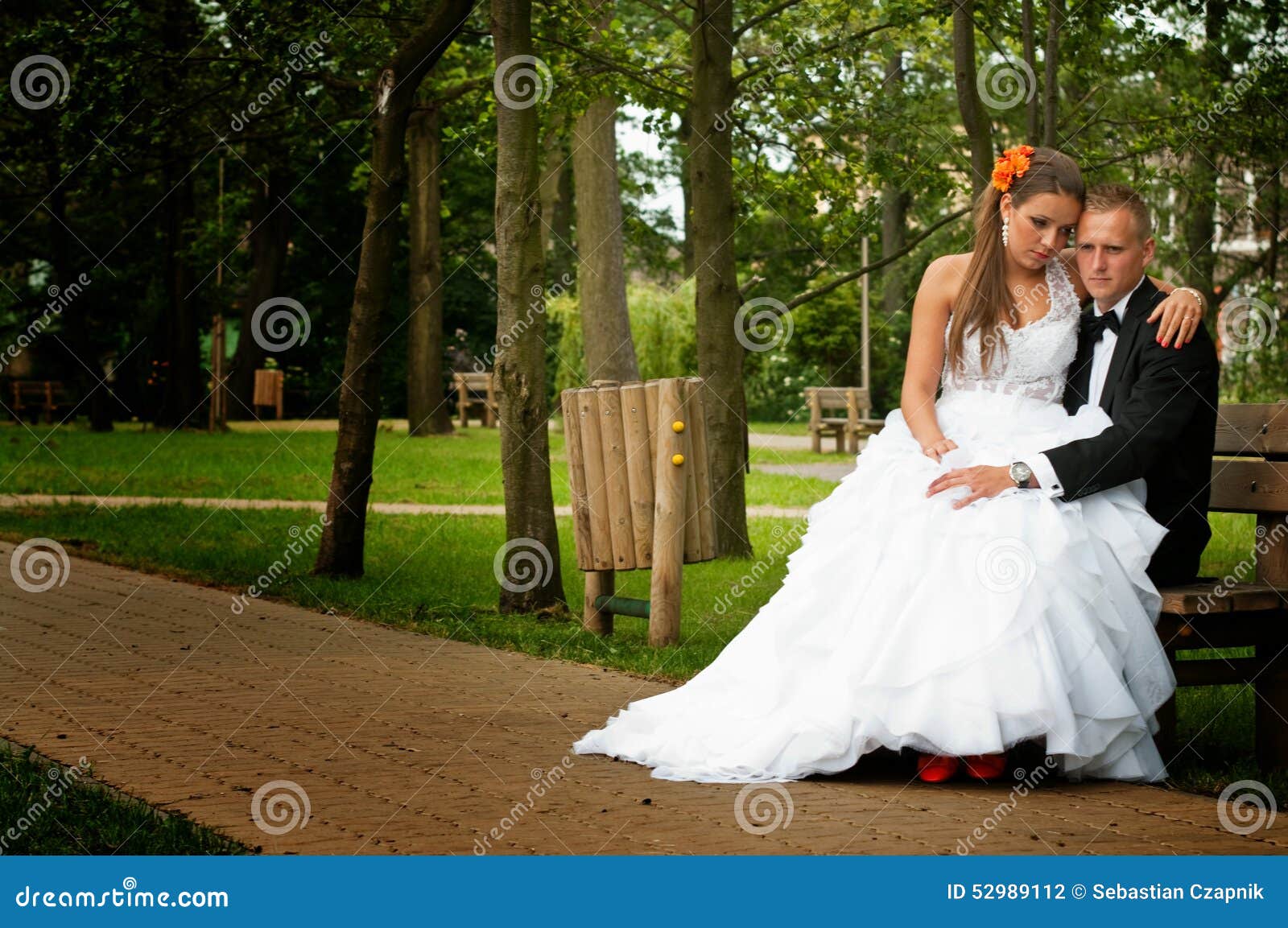 Bride and Groom Seated in Park Stock Photo - Image of preoccupied ...