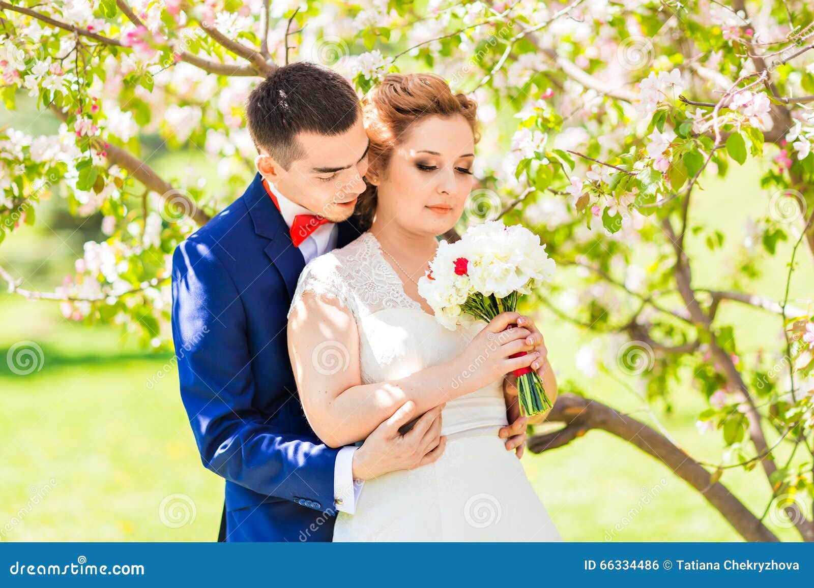 The Bride and Groom in the Spring Nature with Blooming Trees Stock ...