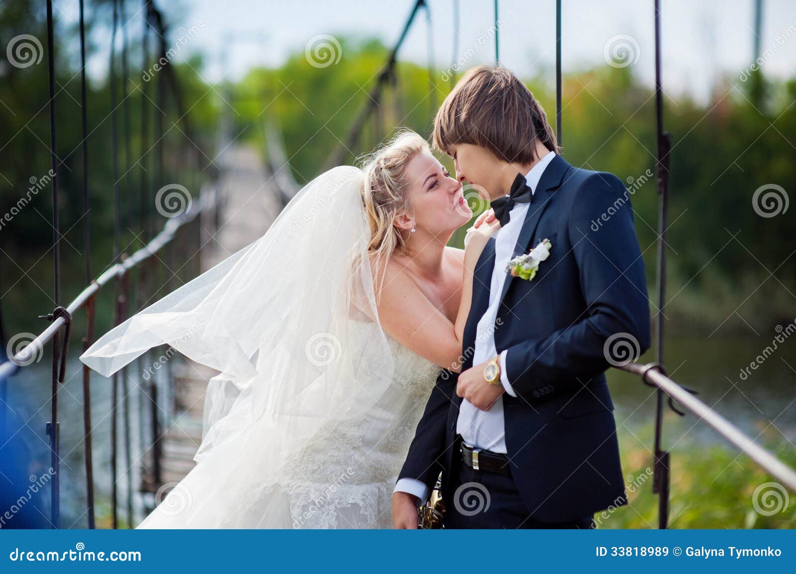 Bride and Groom Standing on a Bridge Stock Image - Image of girl ...