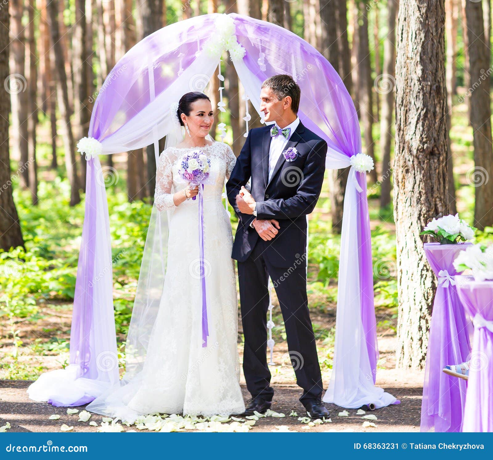 Bride and Groom Under Wedding Arch. Stock Image - Image of contact ...