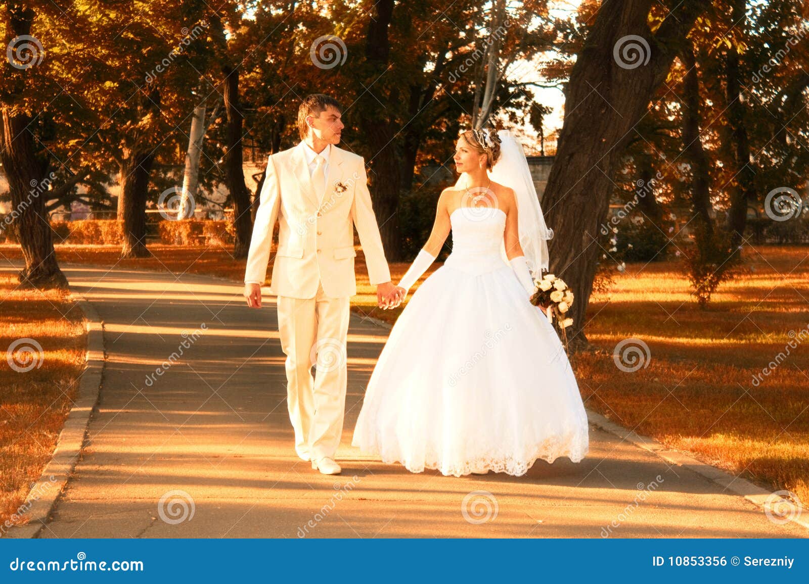 Bride and Groom walking stock photo. Image of young, sidewalk - 10853356