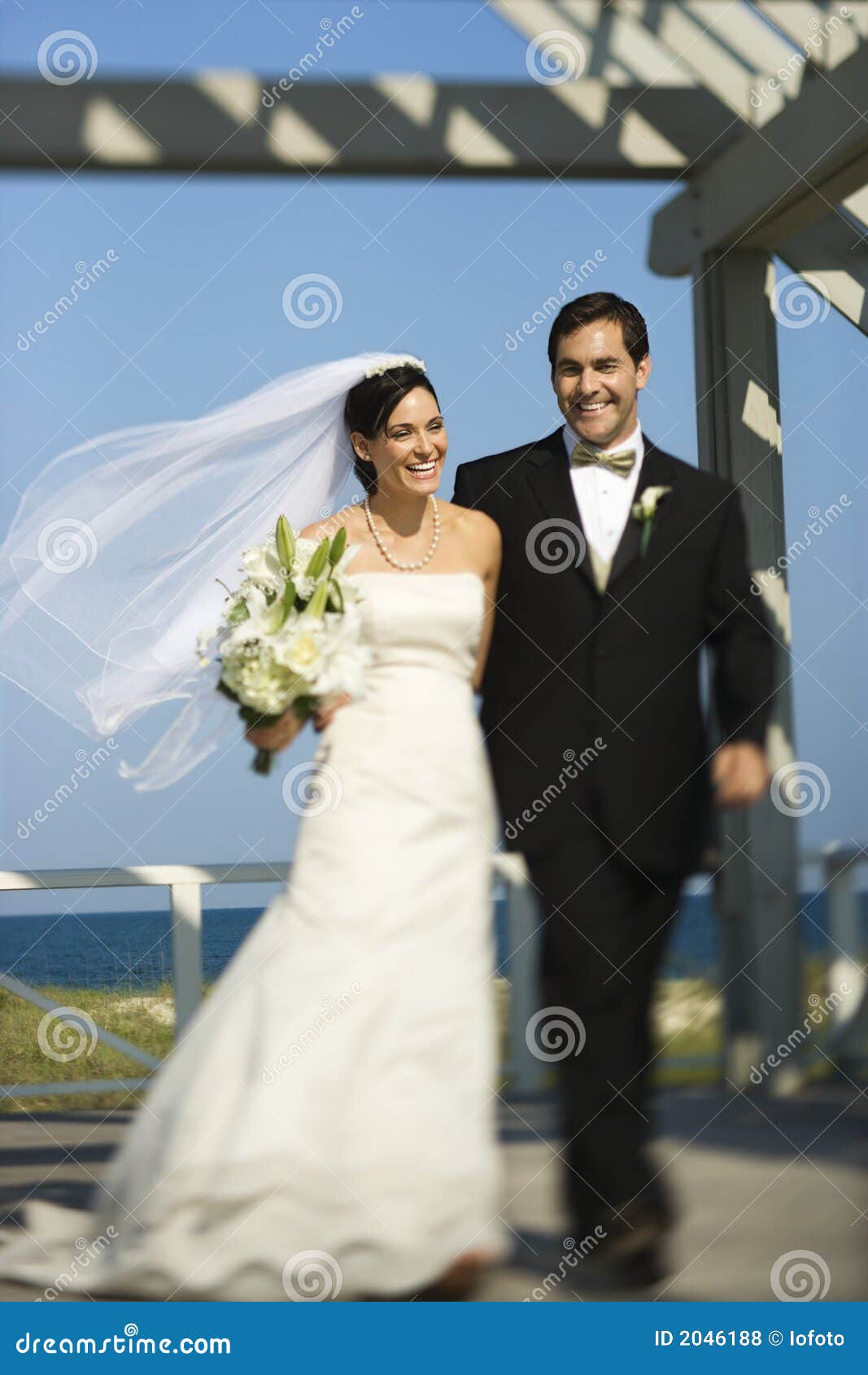 Bride and groom walking. stock photo. Image of outdoors - 2046188