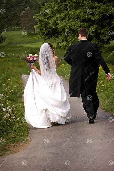 Bride and Groom Walking Away Stock Photo - Image of floral, couples: 179130