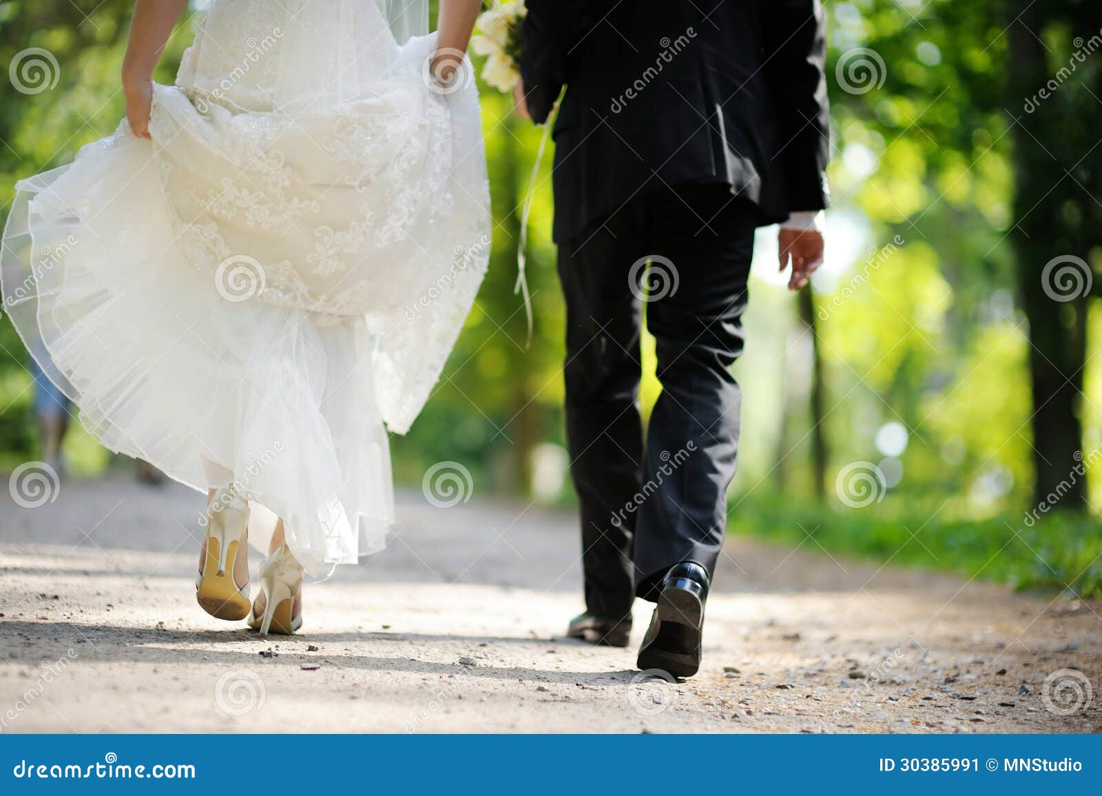 Bride and Groom Walking Away Stock Image - Image of foot, legs: 30385991