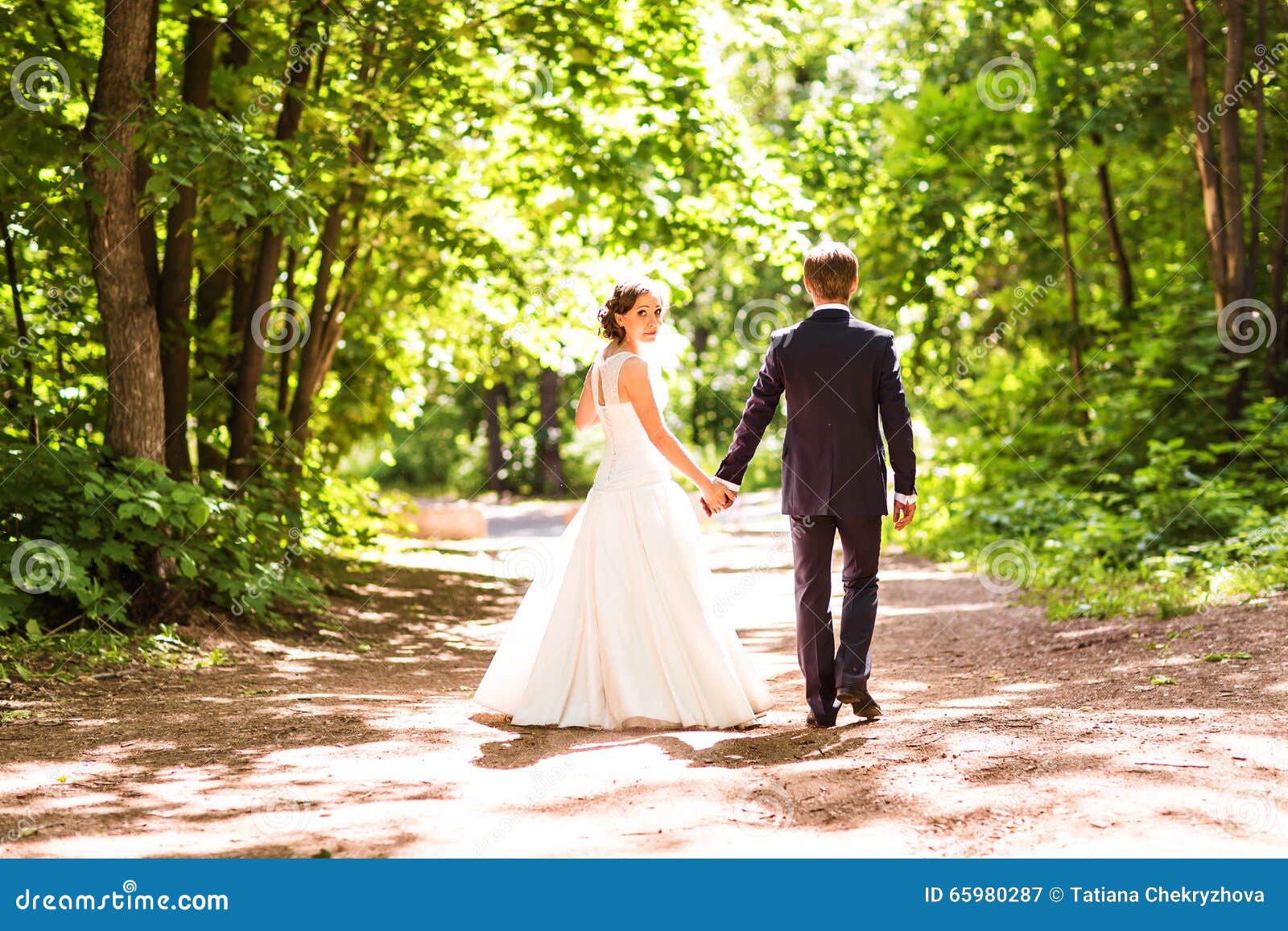 Bride and Groom Walking Away in Summer Park Outdoors Stock Image ...