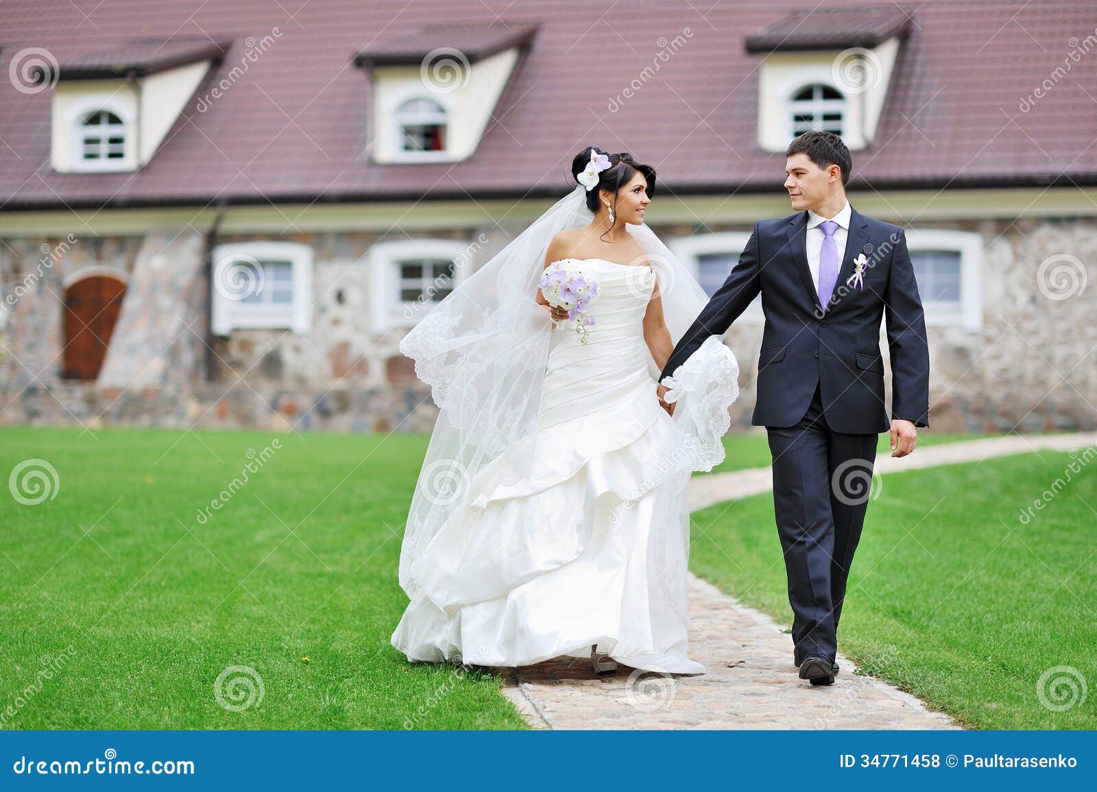Bride and Groom Walking Together Stock Photo - Image of floral ...