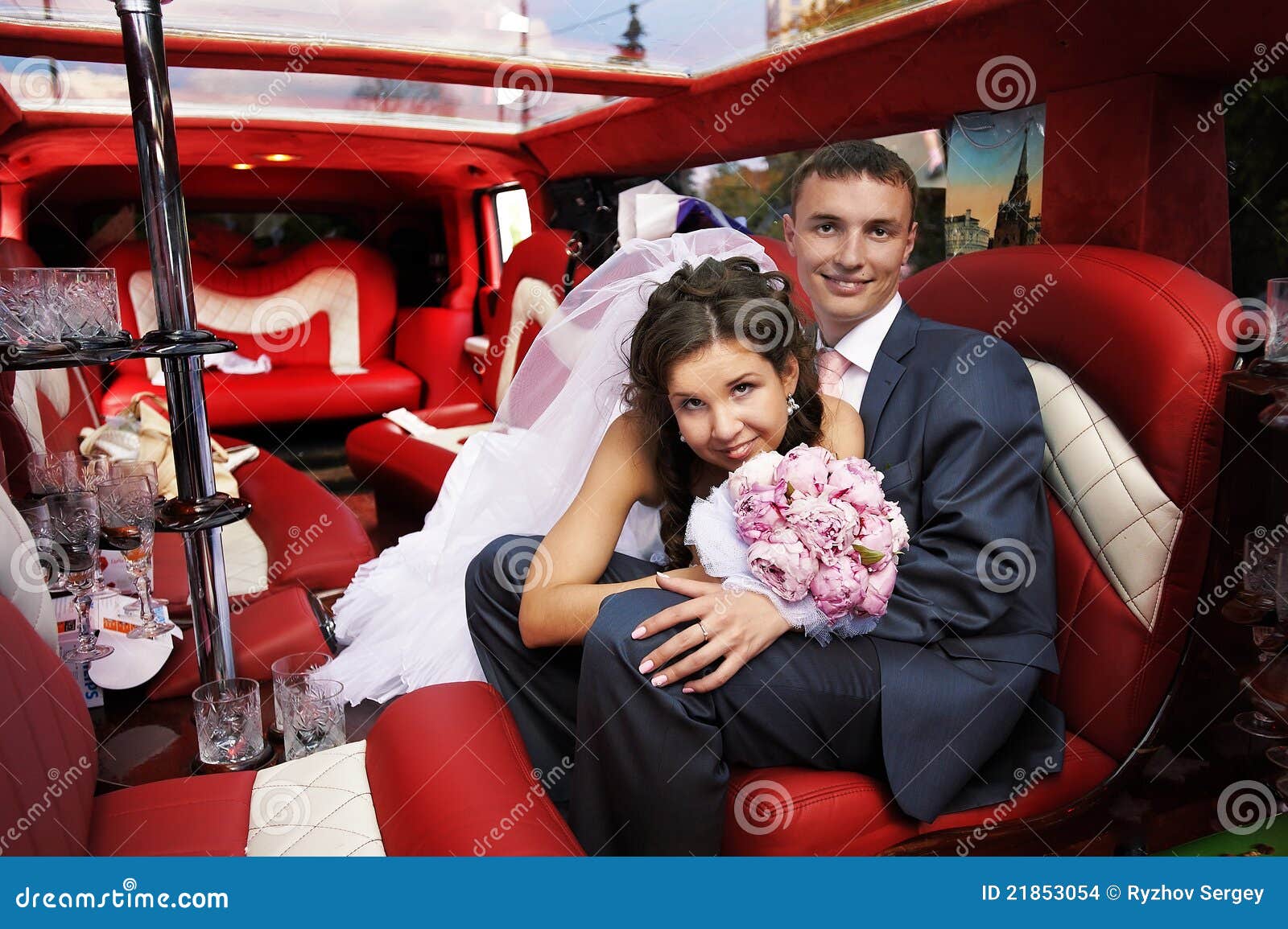 Bride and Groom in Wedding Limousine Stock Photo - Image of flower ...