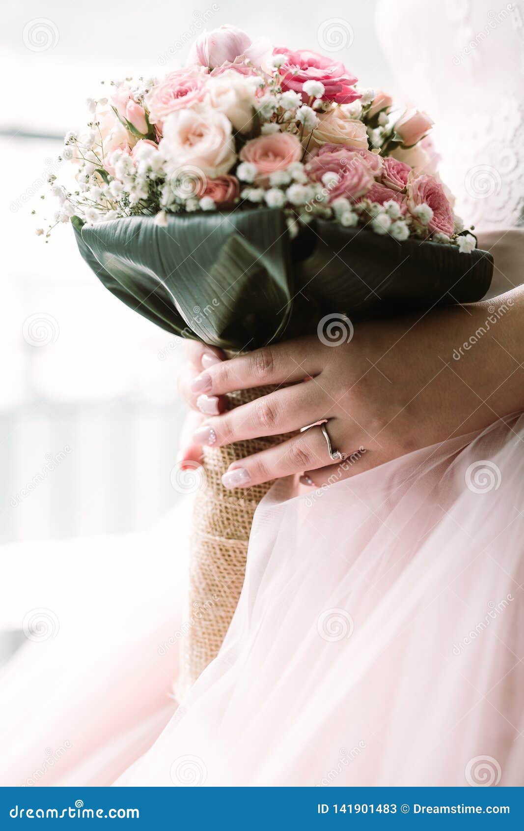 Bride Holding the Bouquet in Front of Her Stock Image - Image of ...