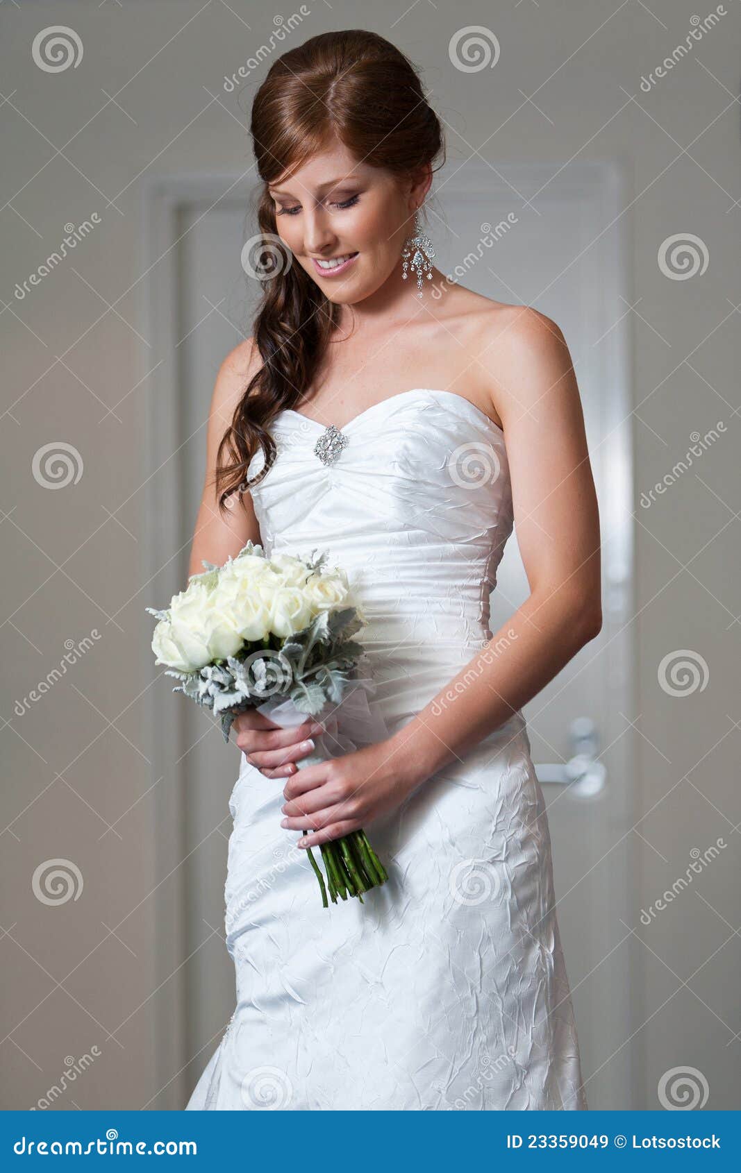 Bride Holding Bouquet and Looking Down Stock Image - Image of love ...