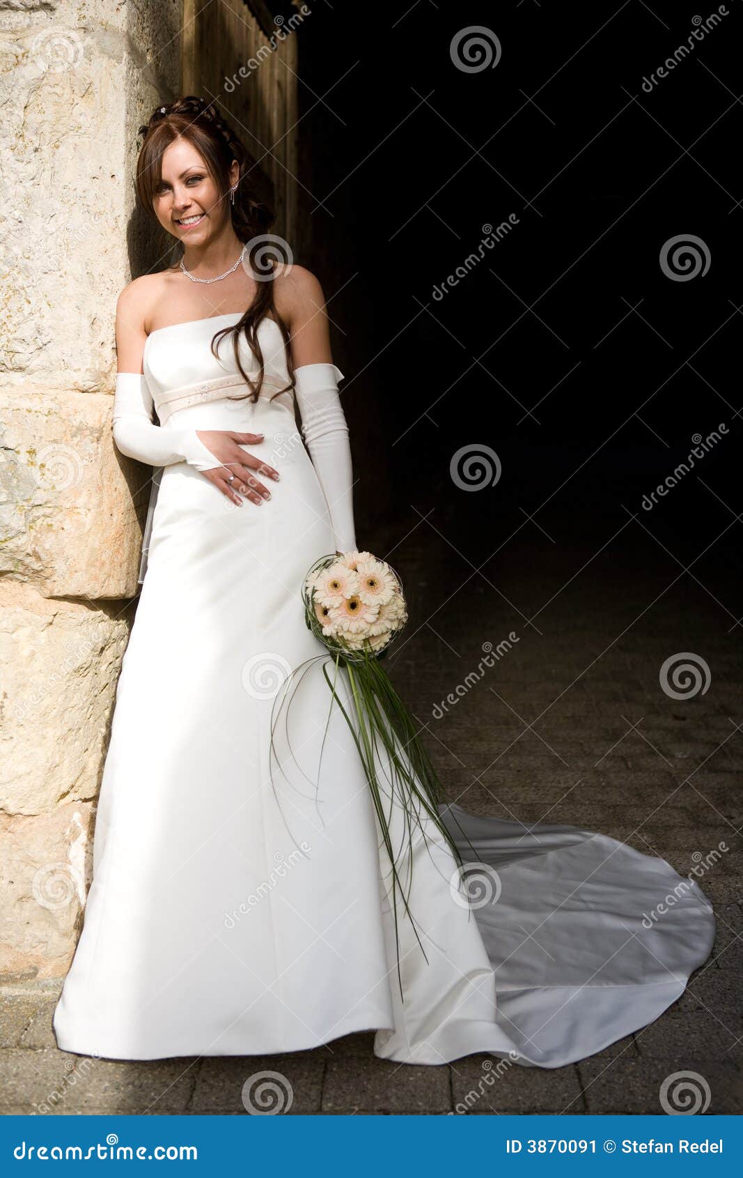 Bride leaning on wall stock image. Image of smiling, holding - 3870091