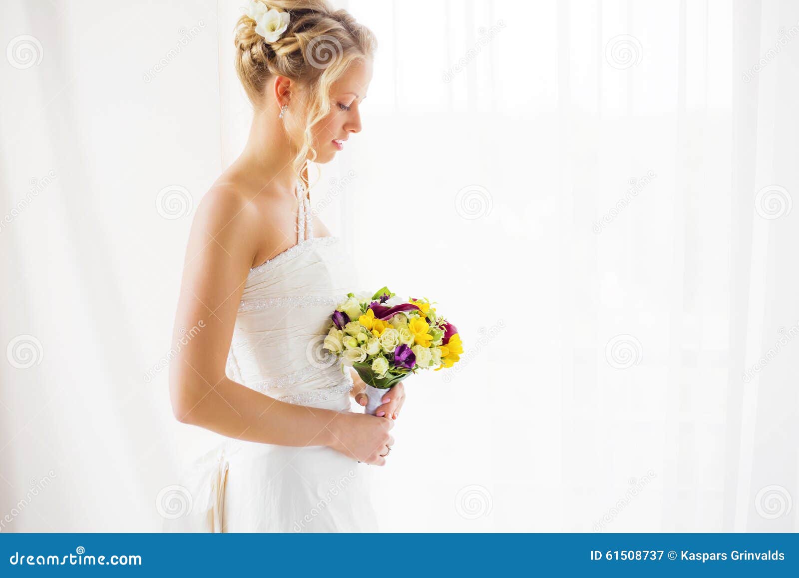 Bride Looking Down at Her Wedding Flowers Stock Image - Image of hand ...