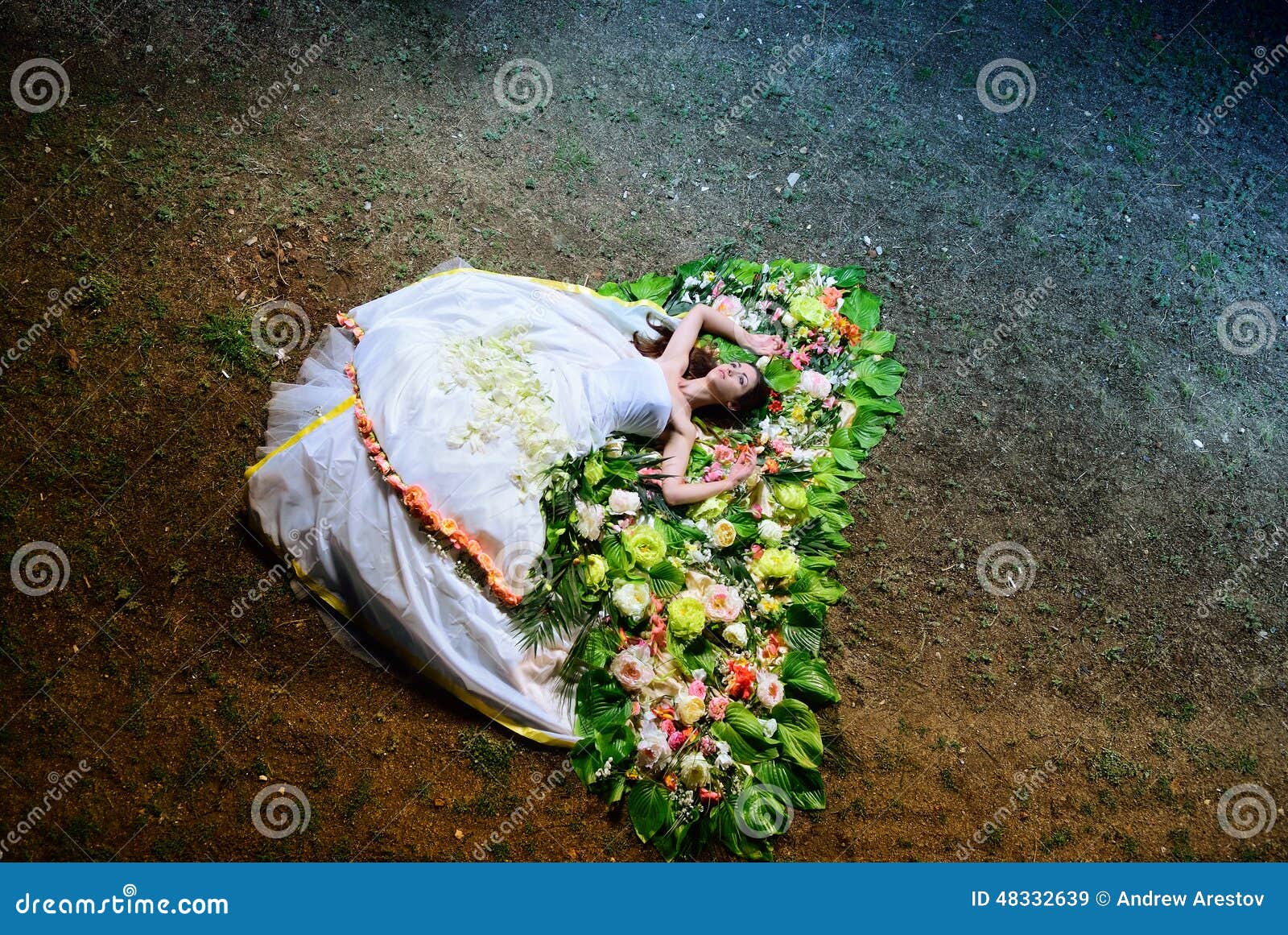 Bride Lying on the Flowers in a Wedding Dress Stock Image - Image of ...