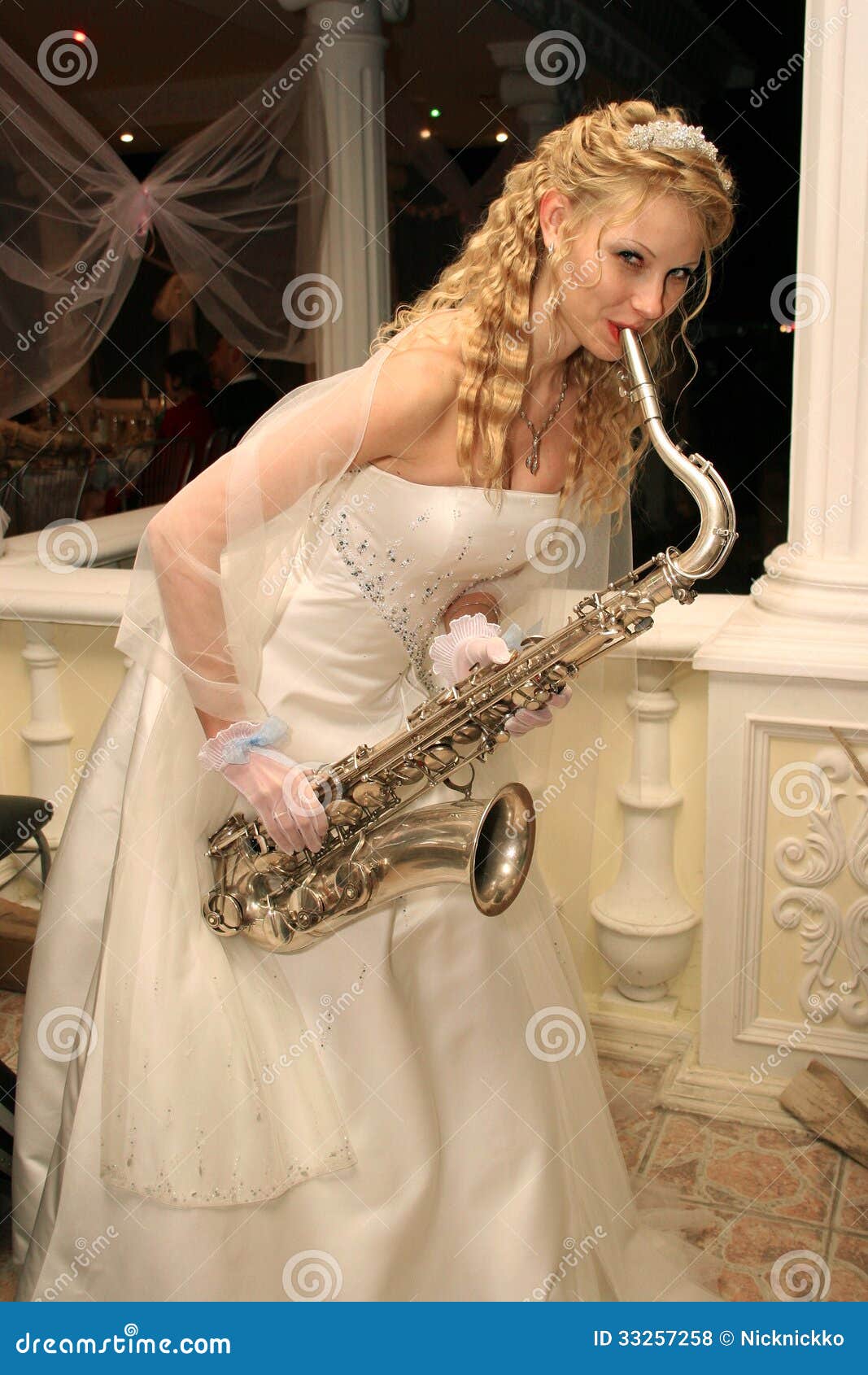 Bride plays the saxophone stock photo. Image of fashion - 33257258