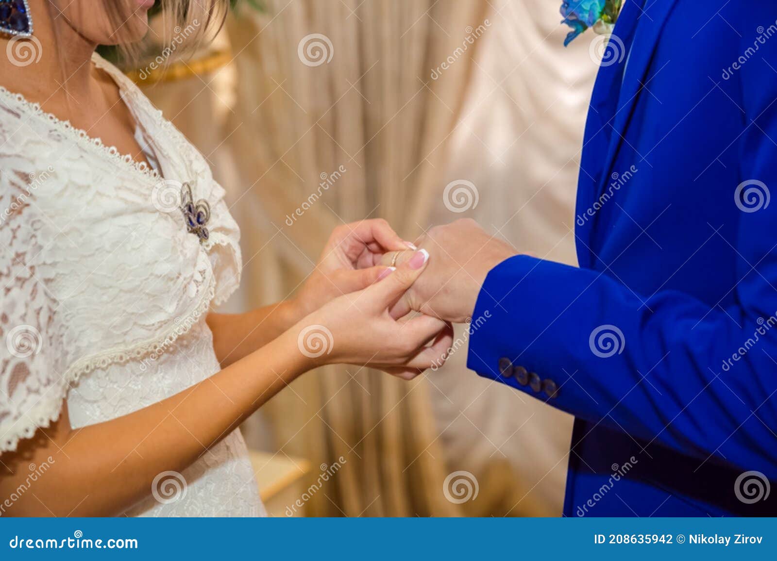 The Bride Puts the Ring on Her Fiance Hand Stock Photo - Image of ...