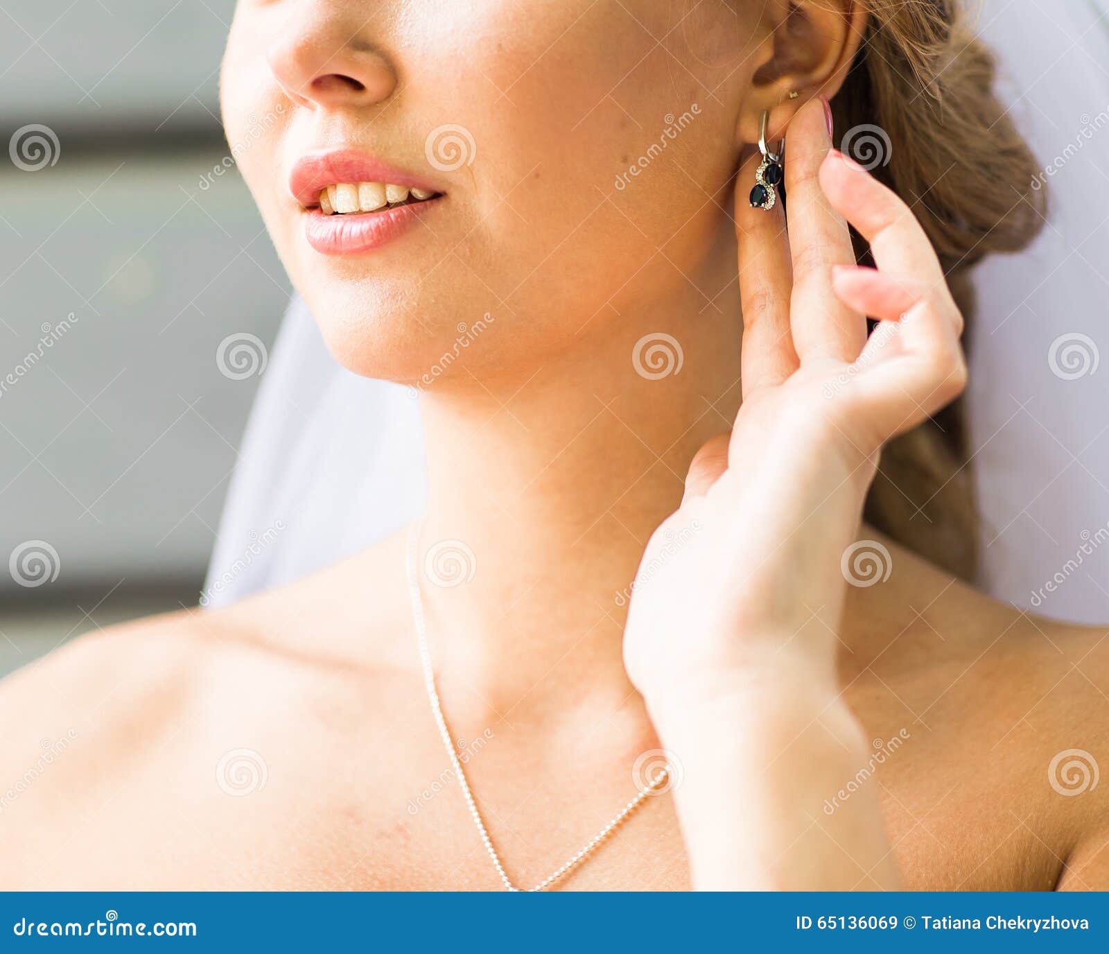 Bride Putting On Diamond Earrings Stock Image Image Of Beauty Bridal
