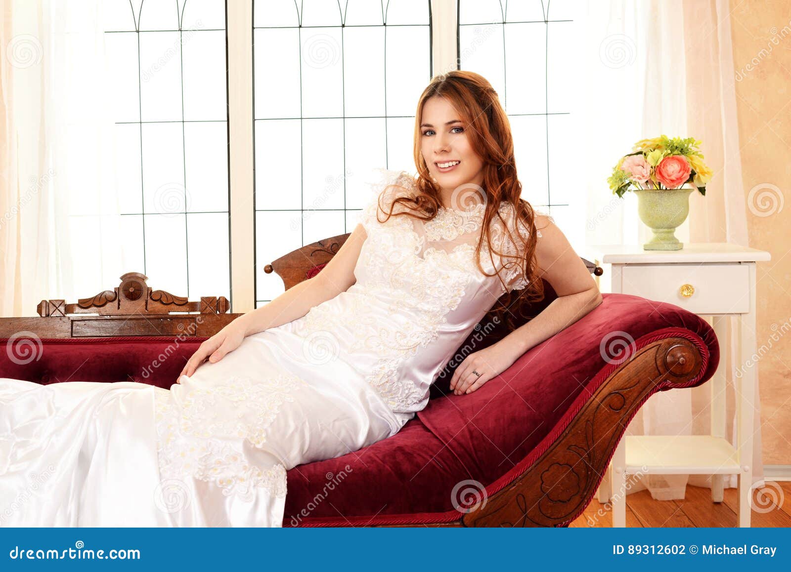 Bride Relaxing on Fainting Couch Stock Photo - Image of beautiful ...