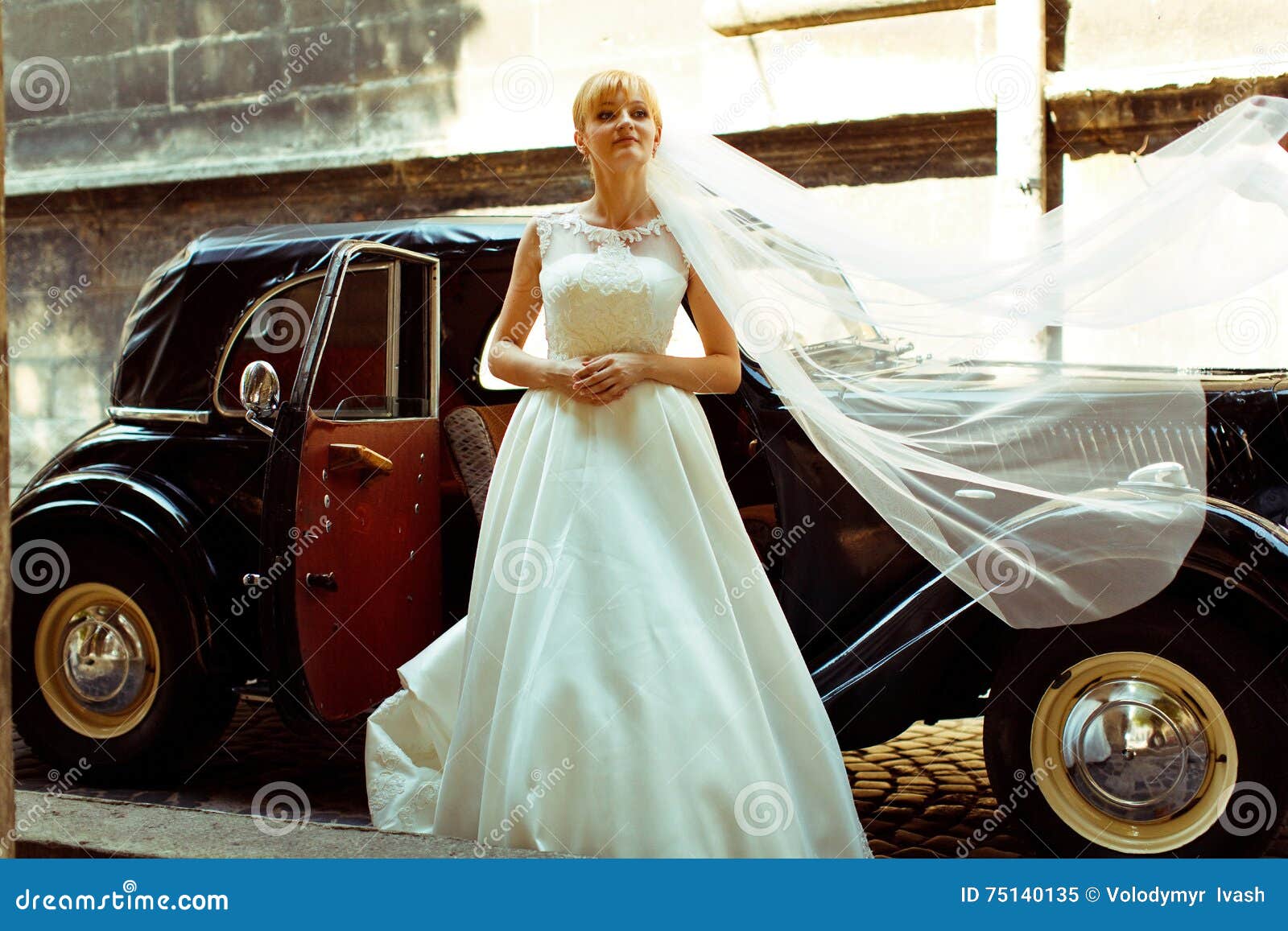 Bride S Veil Spreads Over a Retro Car while she Stands Behind it Stock ...