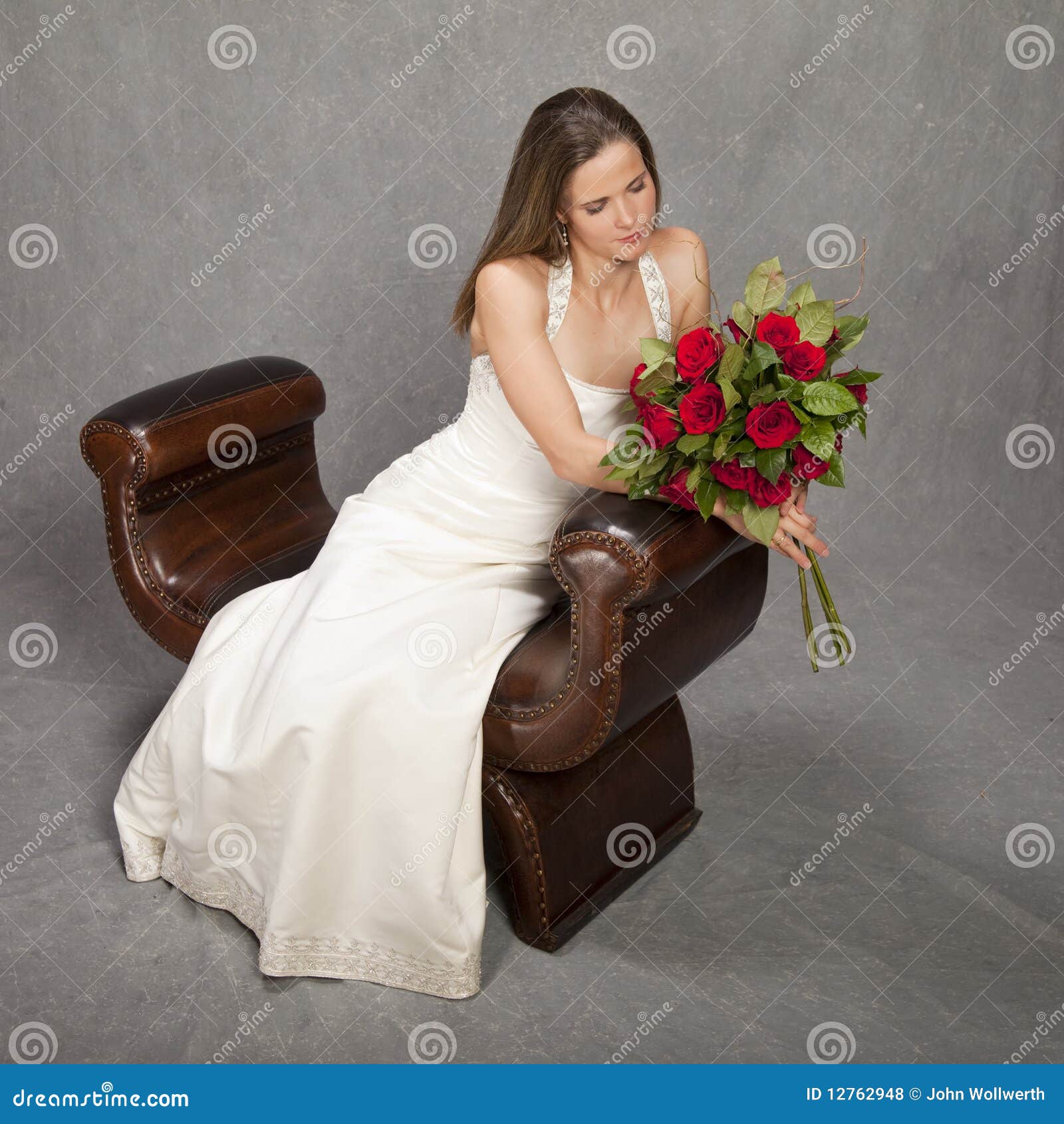 Bride Seated with Roses, Studio Shot Stock Photo - Image of gray ...