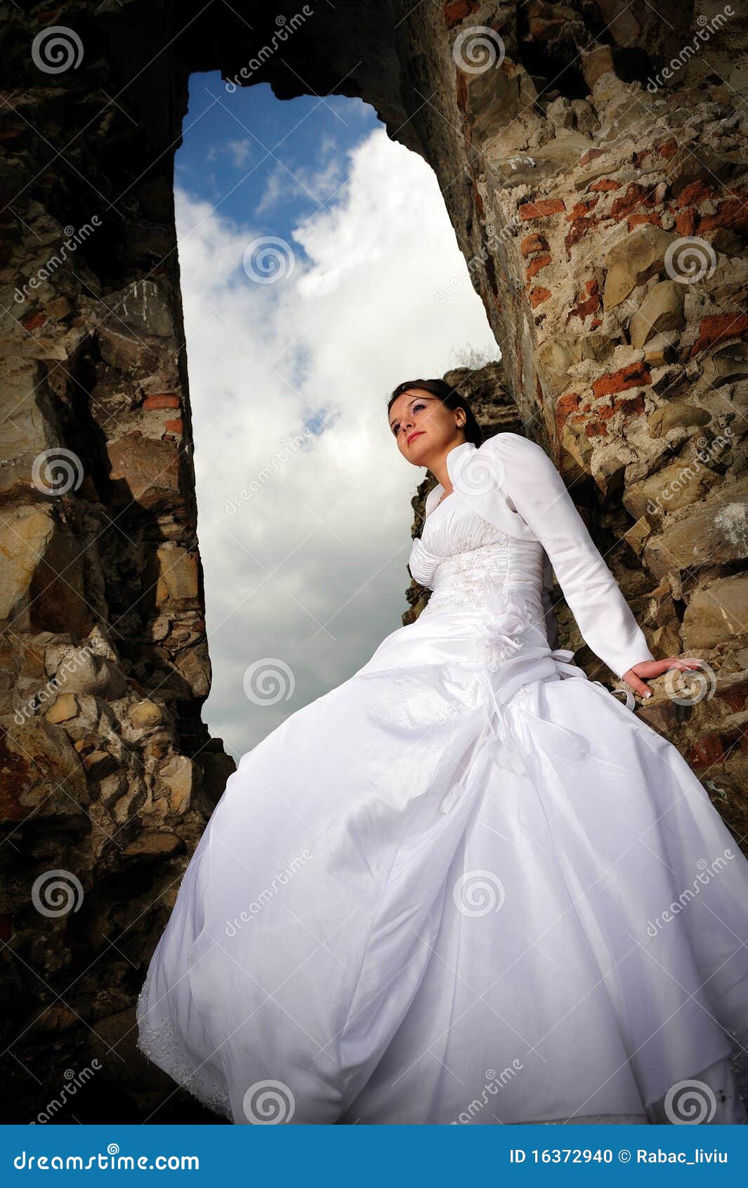 Bride sitting on ruins stock photo. Image of outdoors - 16372940