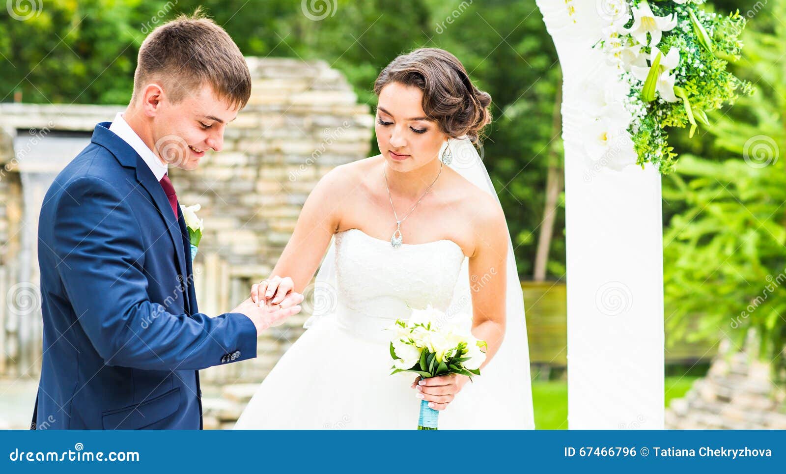 Bride Slipping Ring on Finger of Groom at Wedding Stock Photo - Image ...