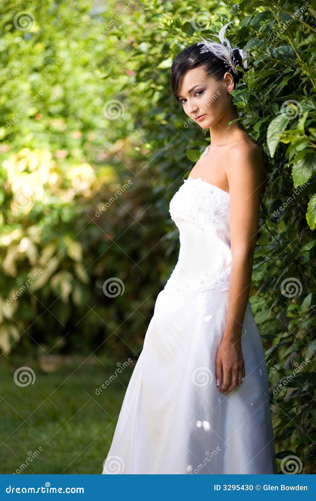 Bride standing in garden stock photo. Image of cheeky - 3295430