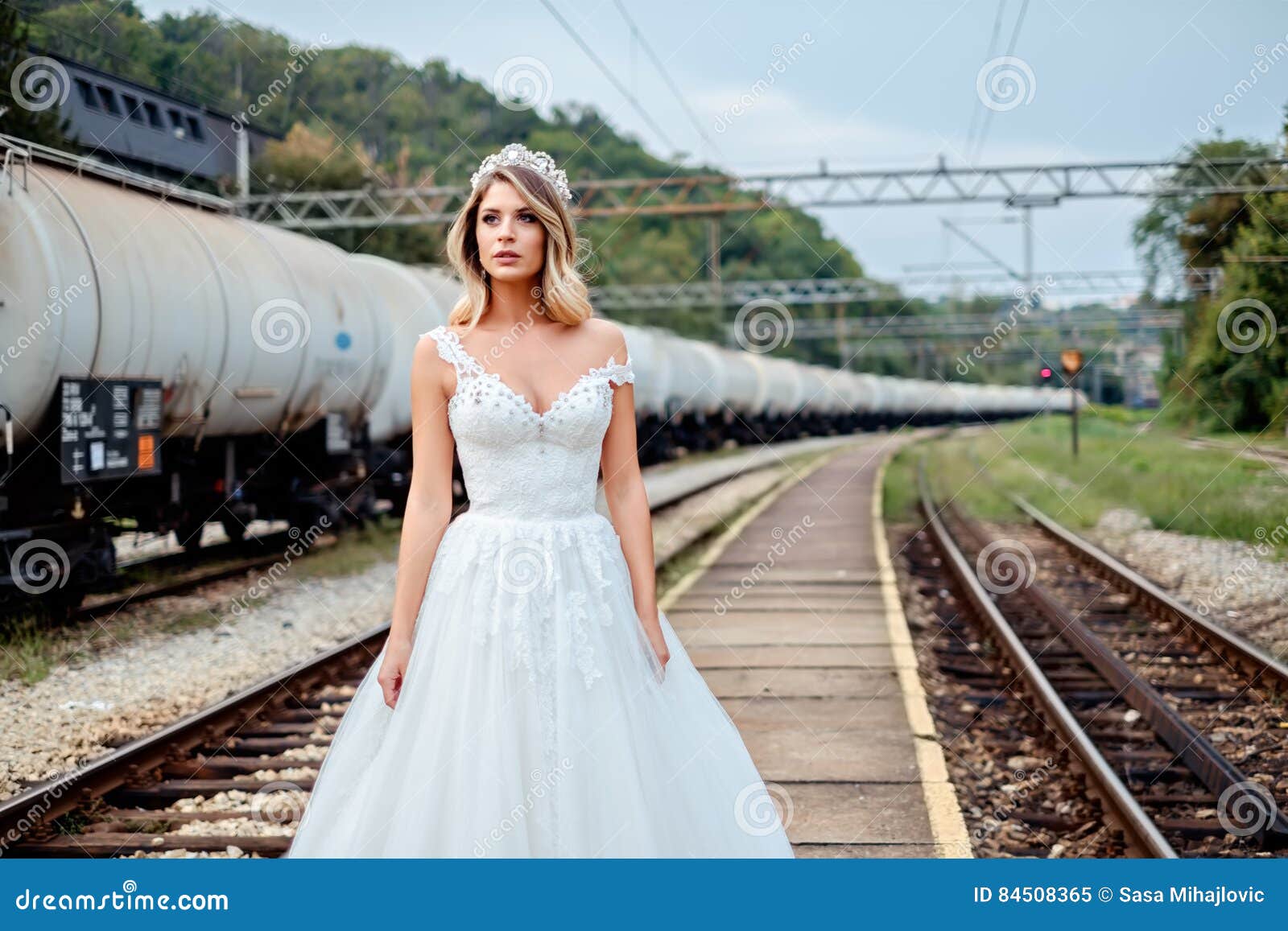 Bride Standing by Railroad Tracks Stock Image - Image of female ...